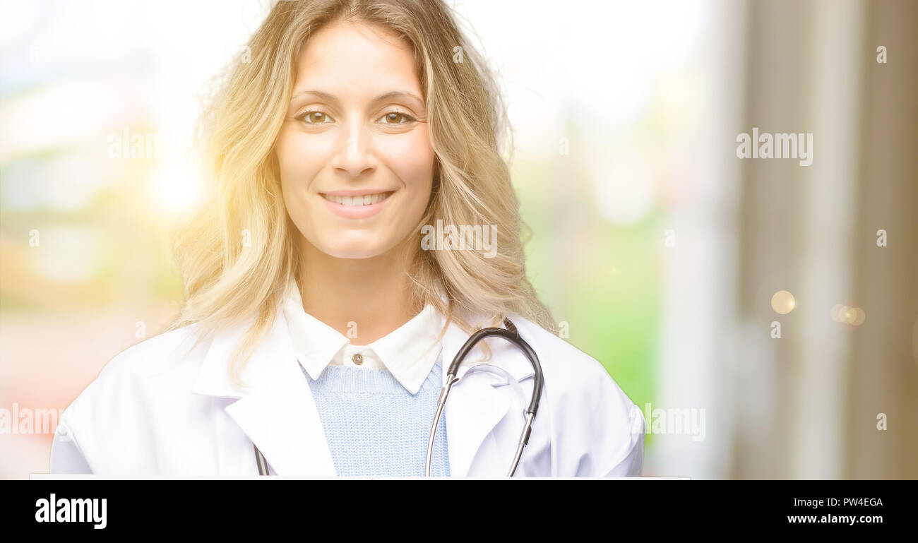 Young doctor woman, medical professional holding blank advertising ...