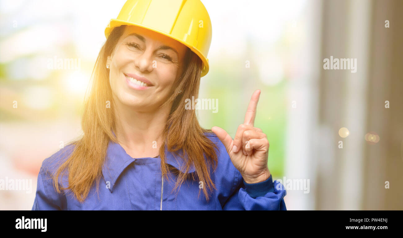 Engineer construction worker woman pointing away side with finger Stock ...