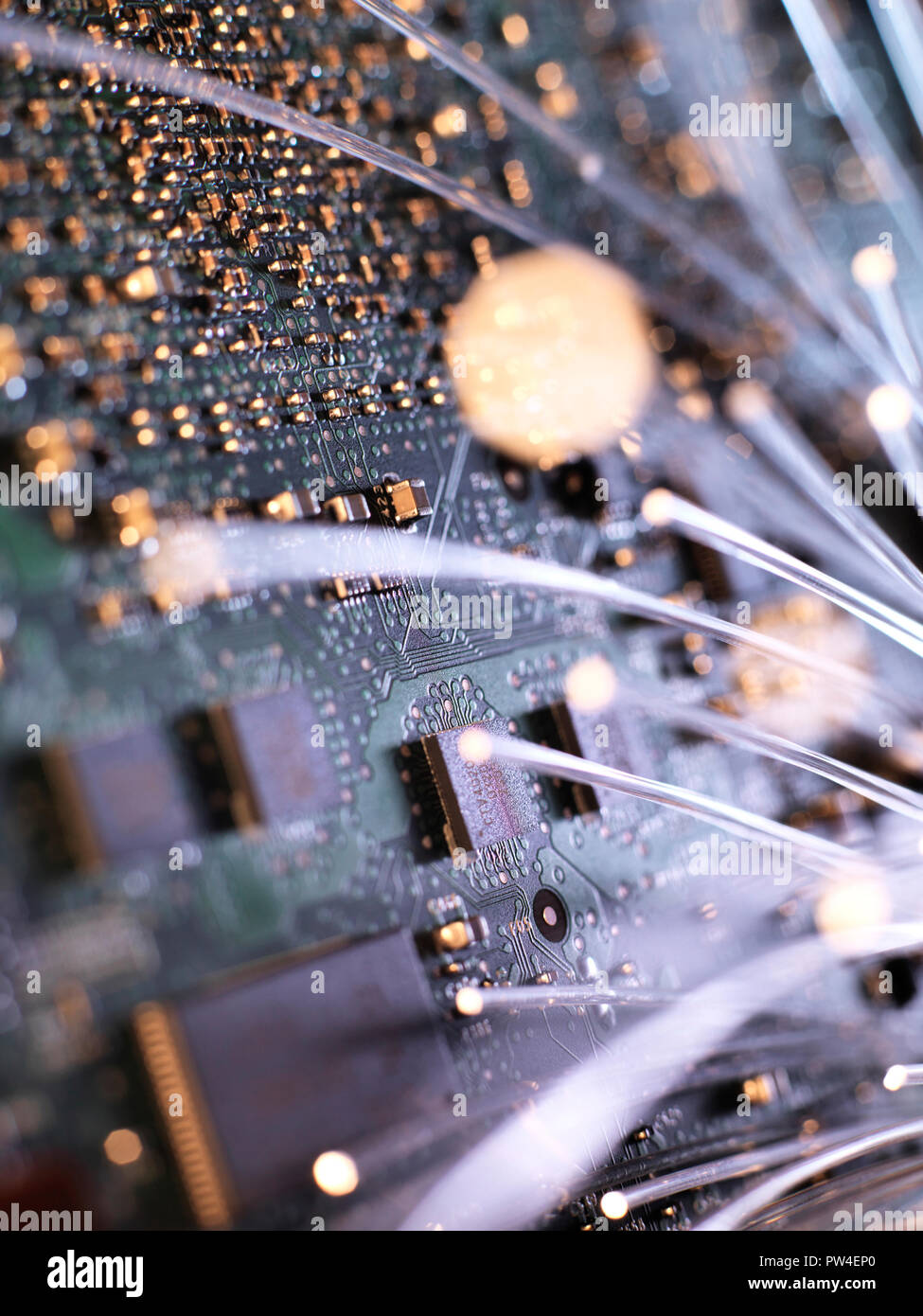 High angle view of illuminated fiber optics on circuit board of laptop ...