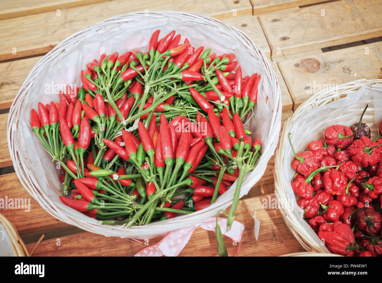 Many fresh red chilli peppers on the market hi-res stock photography ...