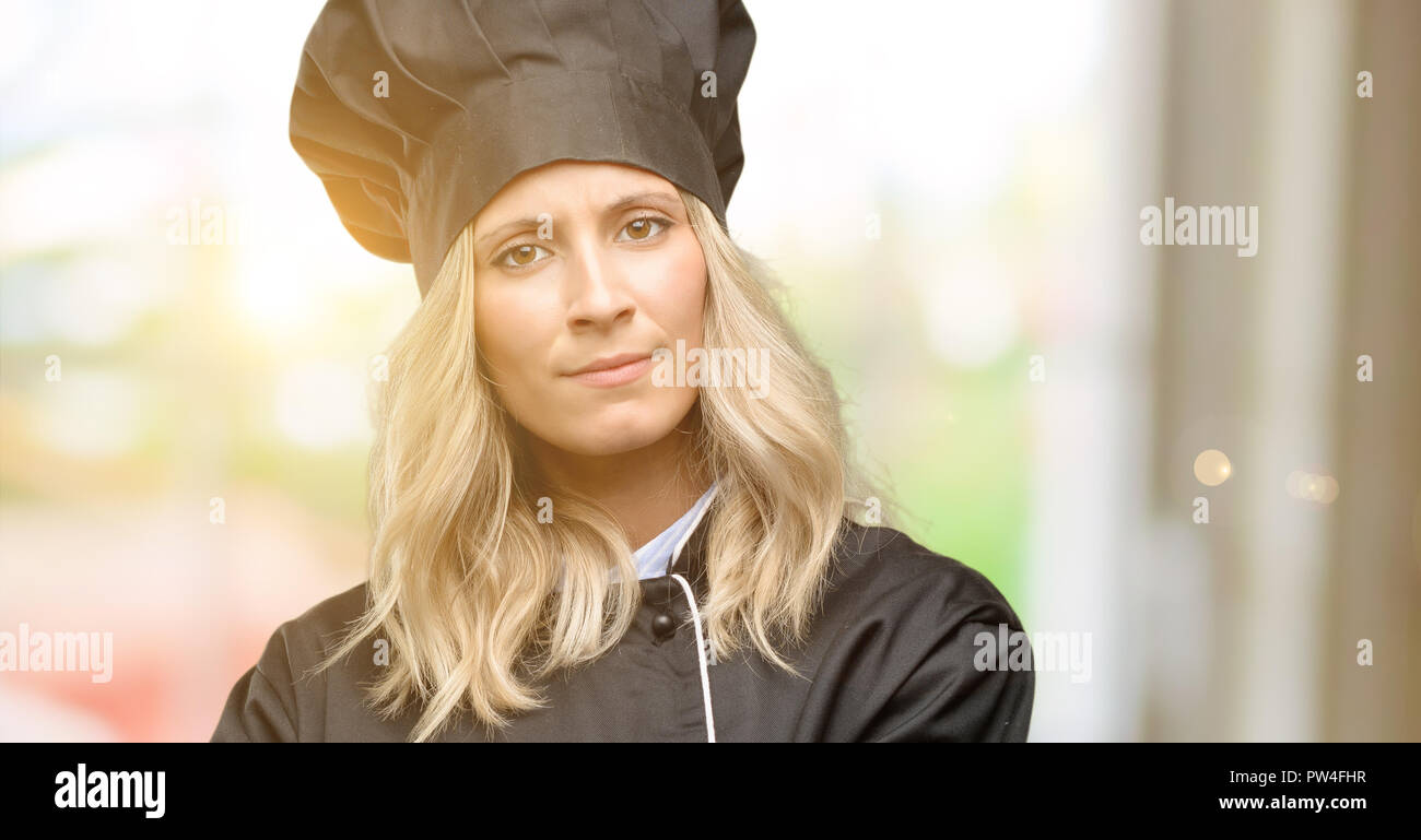 Laughing blonde woman chef looking hi-res stock photography and images ...