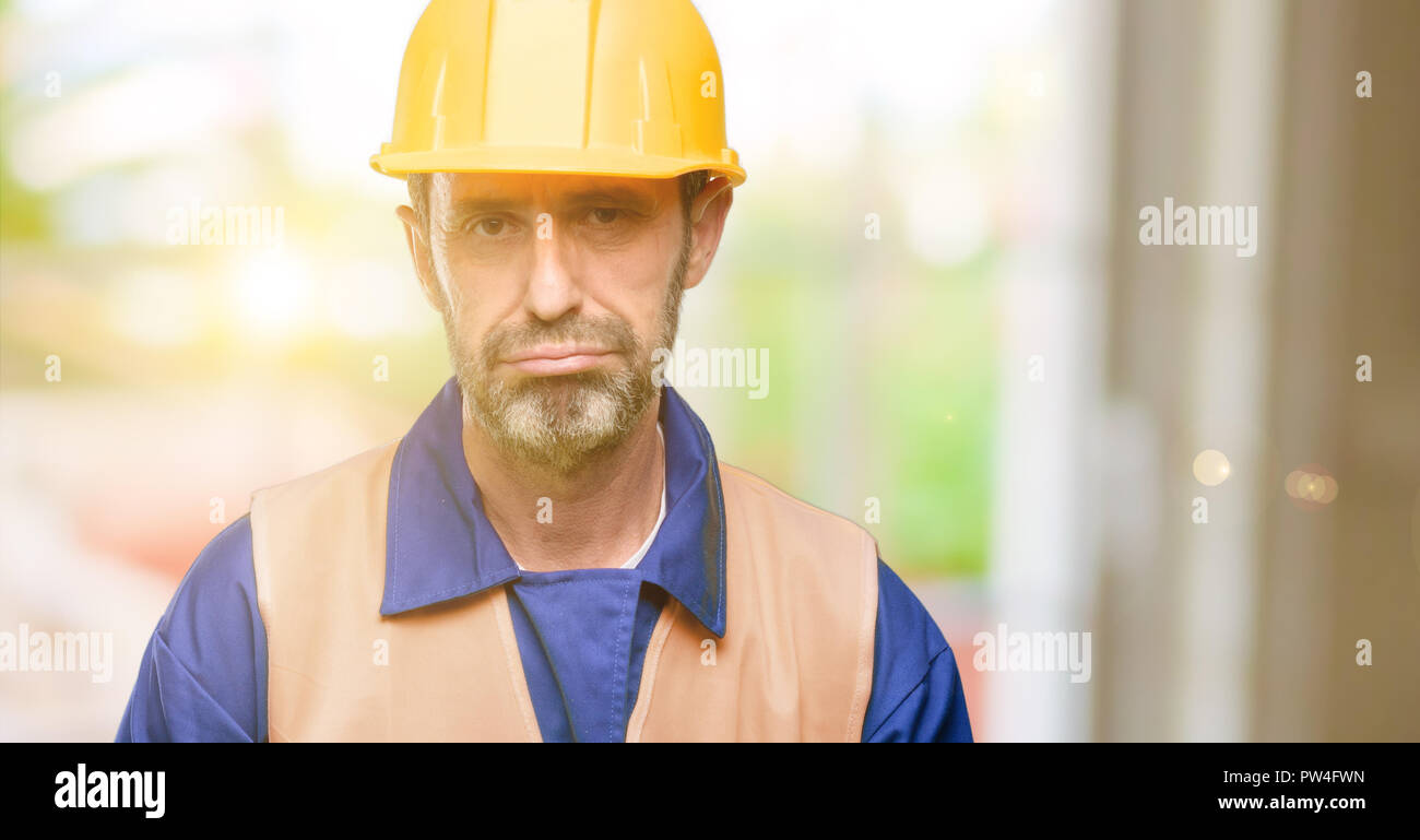 Rubbing head worker blue hi-res stock photography and images - Alamy