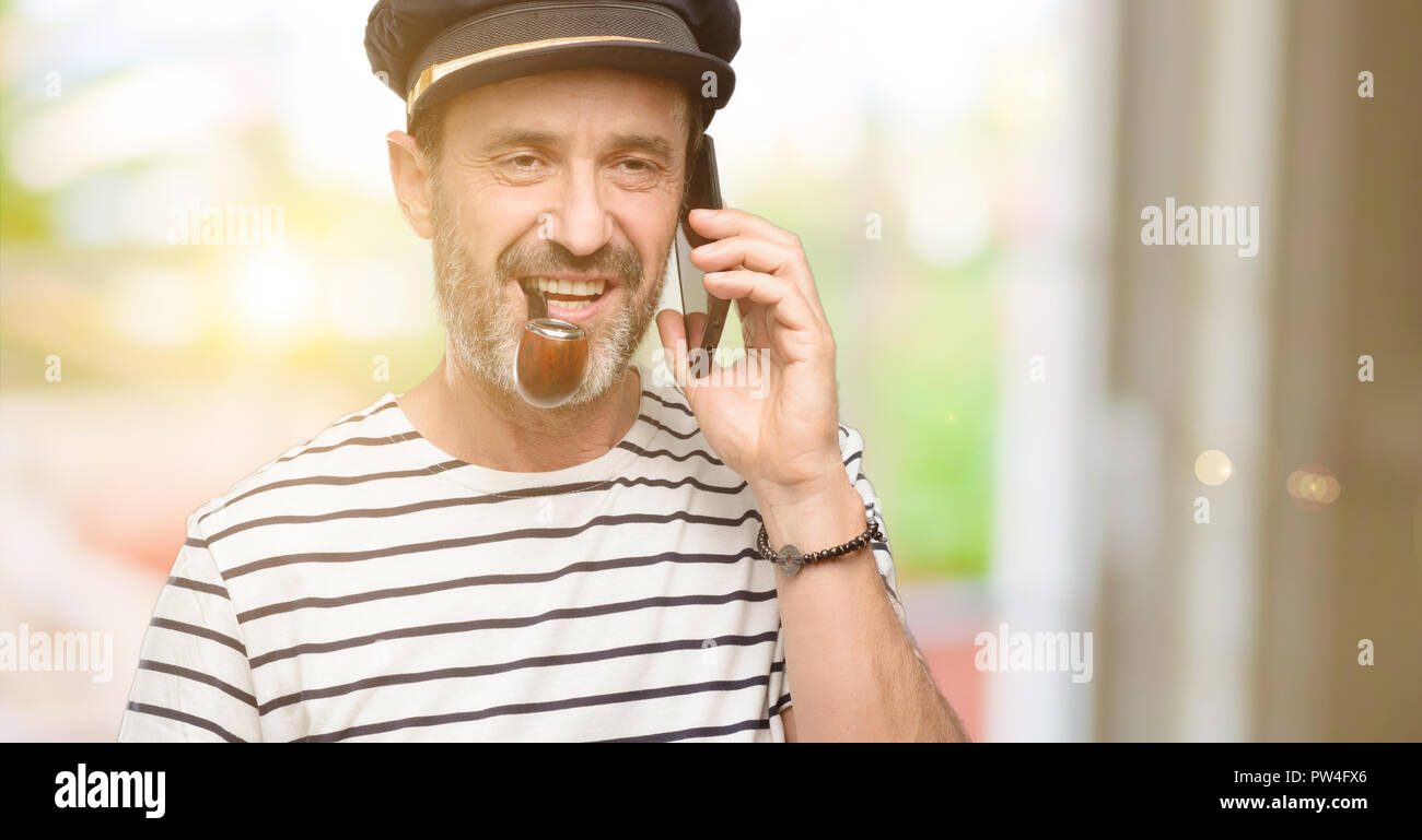 Senior man smoking pipe talking hi-res stock photography and images - Alamy