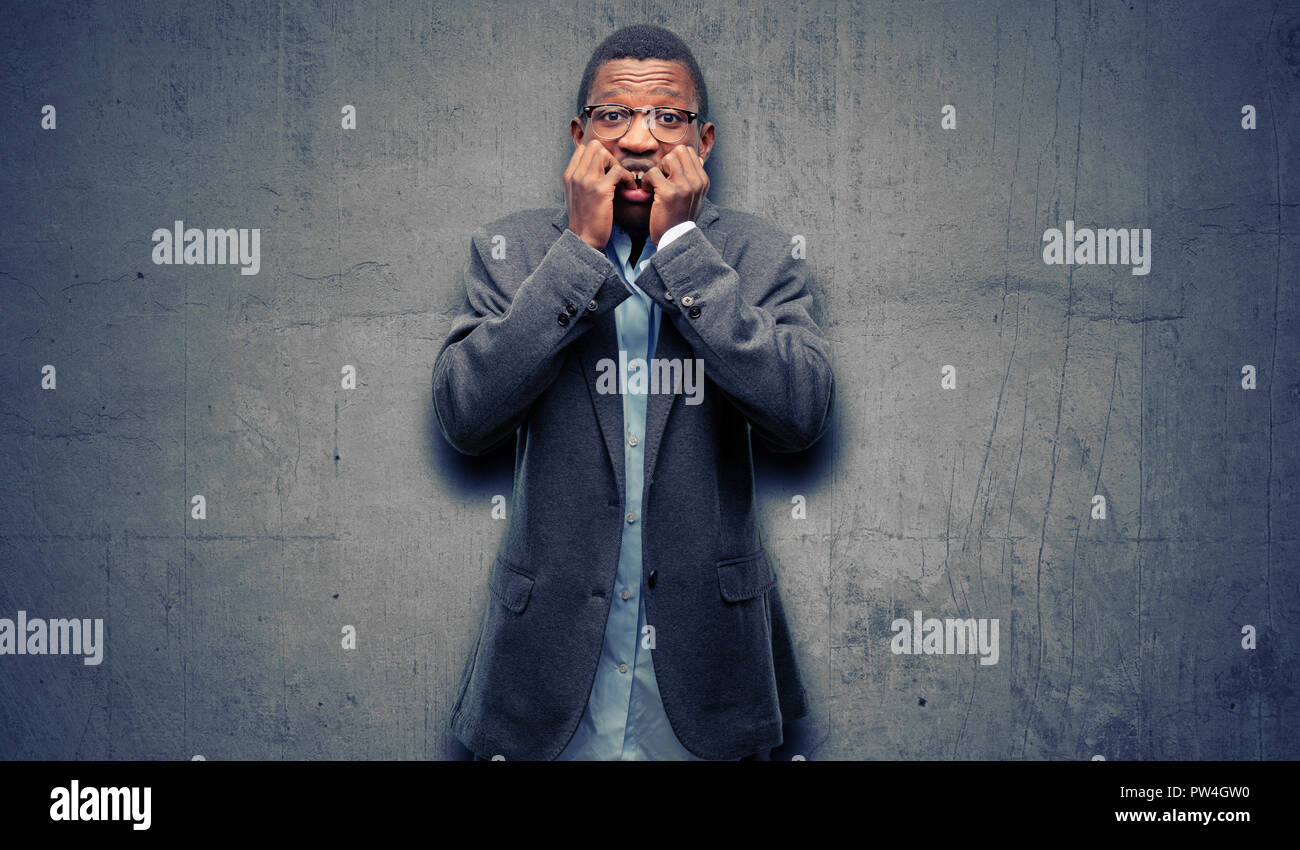 African black man wearing jacket terrified and nervous expressing ...