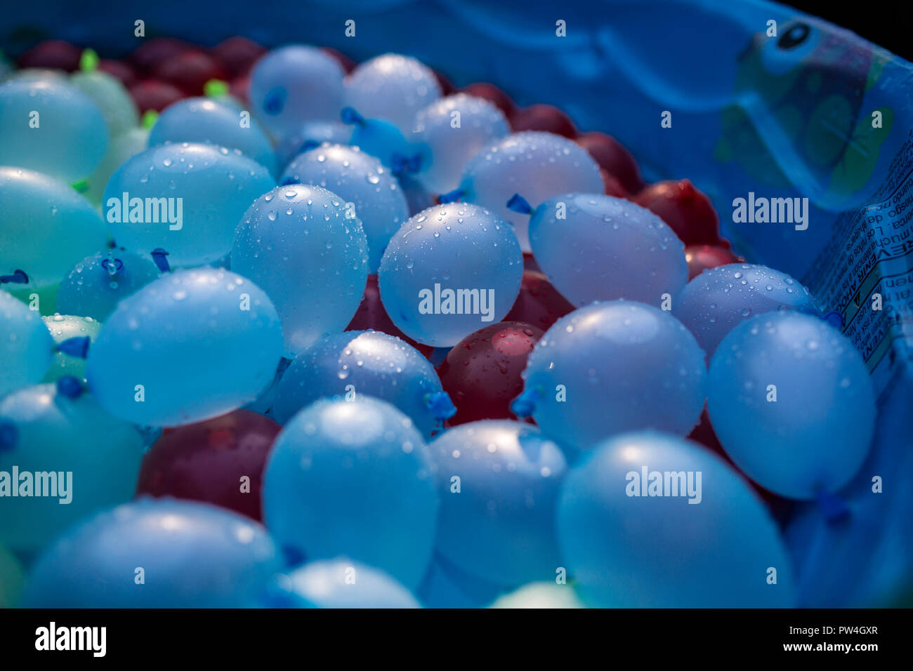 High angle view of water bombs in bucket Stock Photo - Alamy