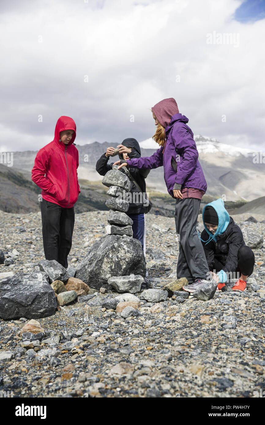 Child stacking rocks hi-res stock photography and images - Alamy