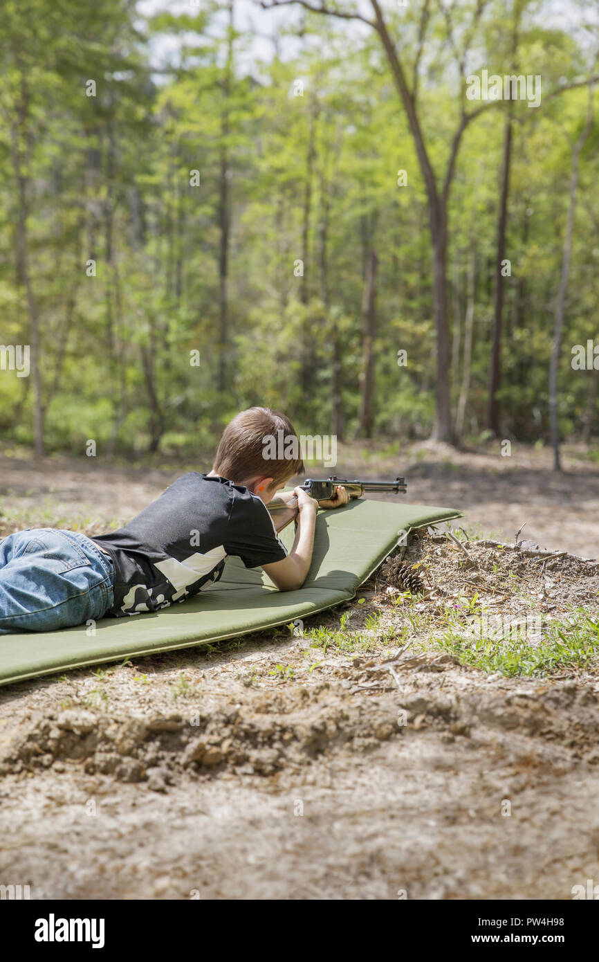 Boy with rifle hi-res stock photography and images - Alamy