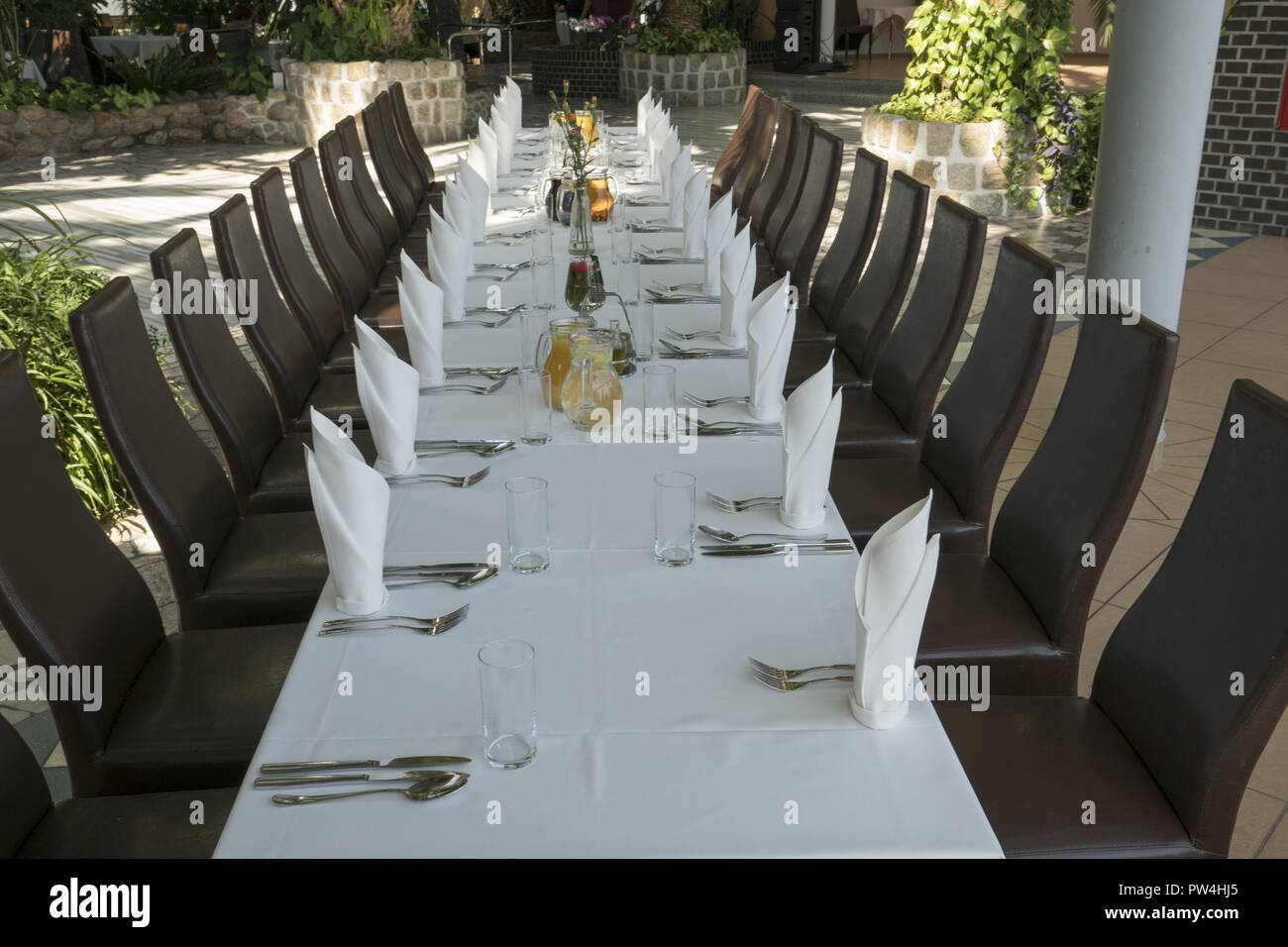 Restaurant table set for a party of 20 Stock Photo - Alamy