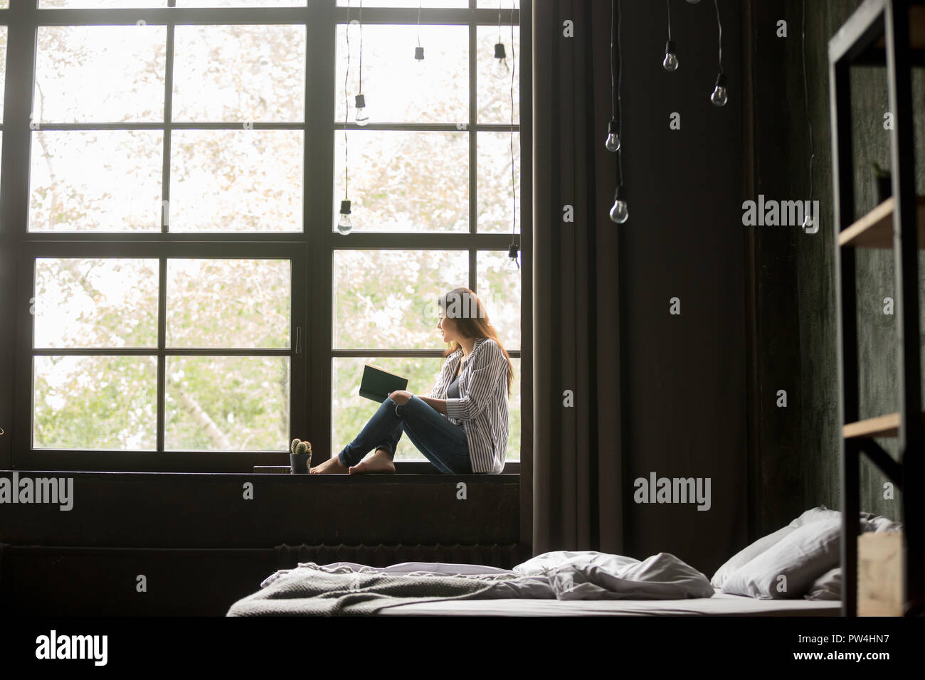 Cozy reading book window hi-res stock photography and images - Alamy