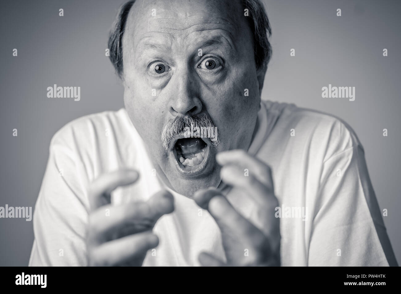 Close up portrait of a scared frightened old man in expression of fear ...