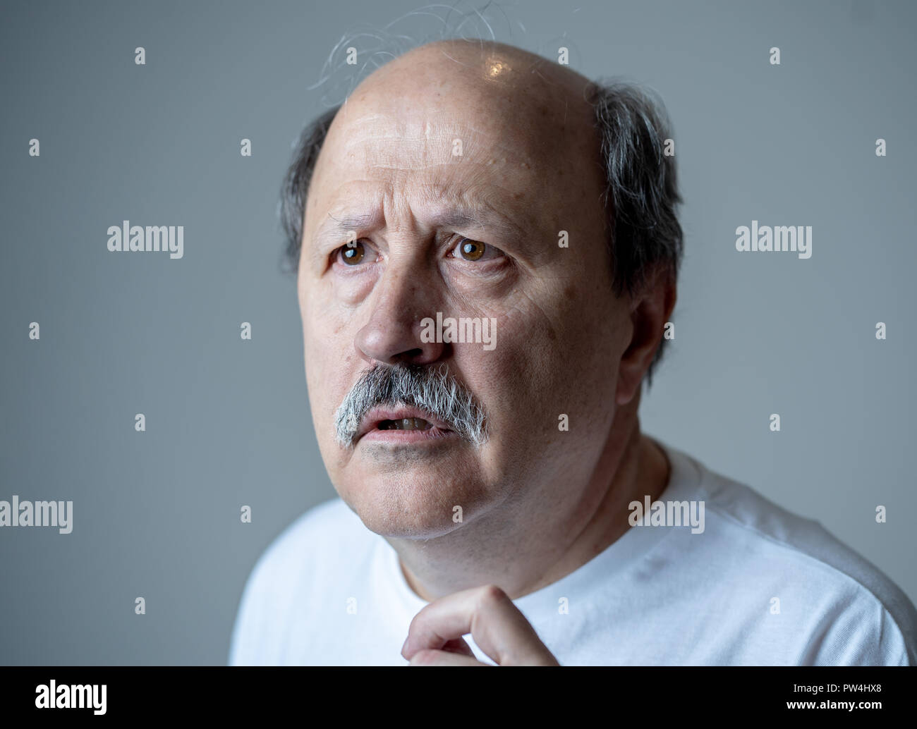 Old man thinking studio hi-res stock photography and images - Alamy