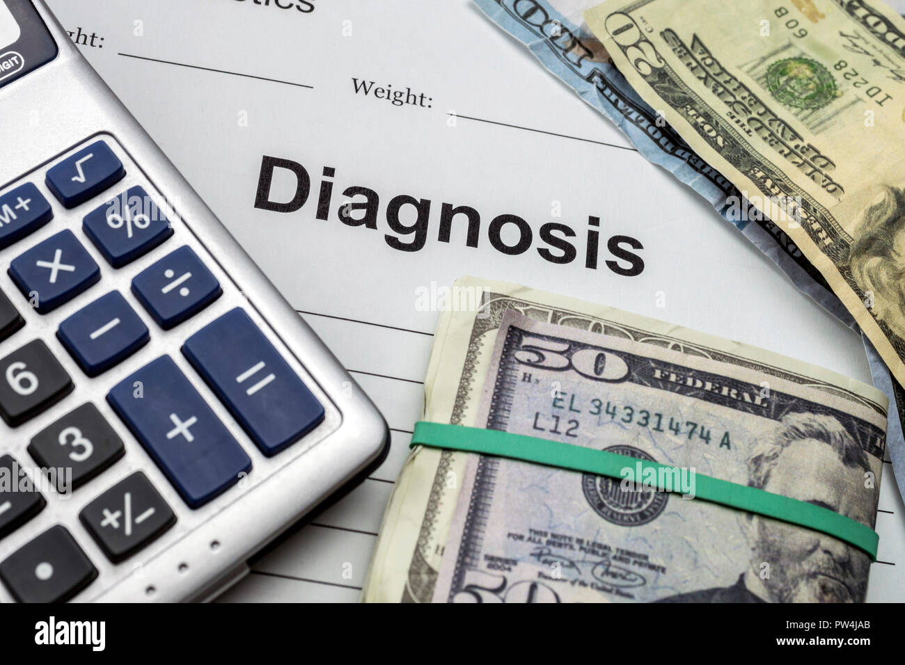 Calculator next to a stethoscope, a concept of the cost of health care ...