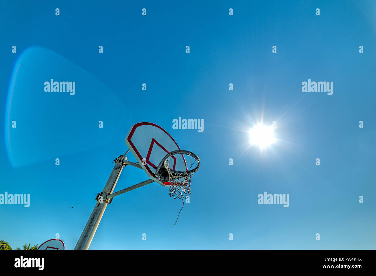Sun shining over a basketball hoop in Laguna Beach, California Stock ...