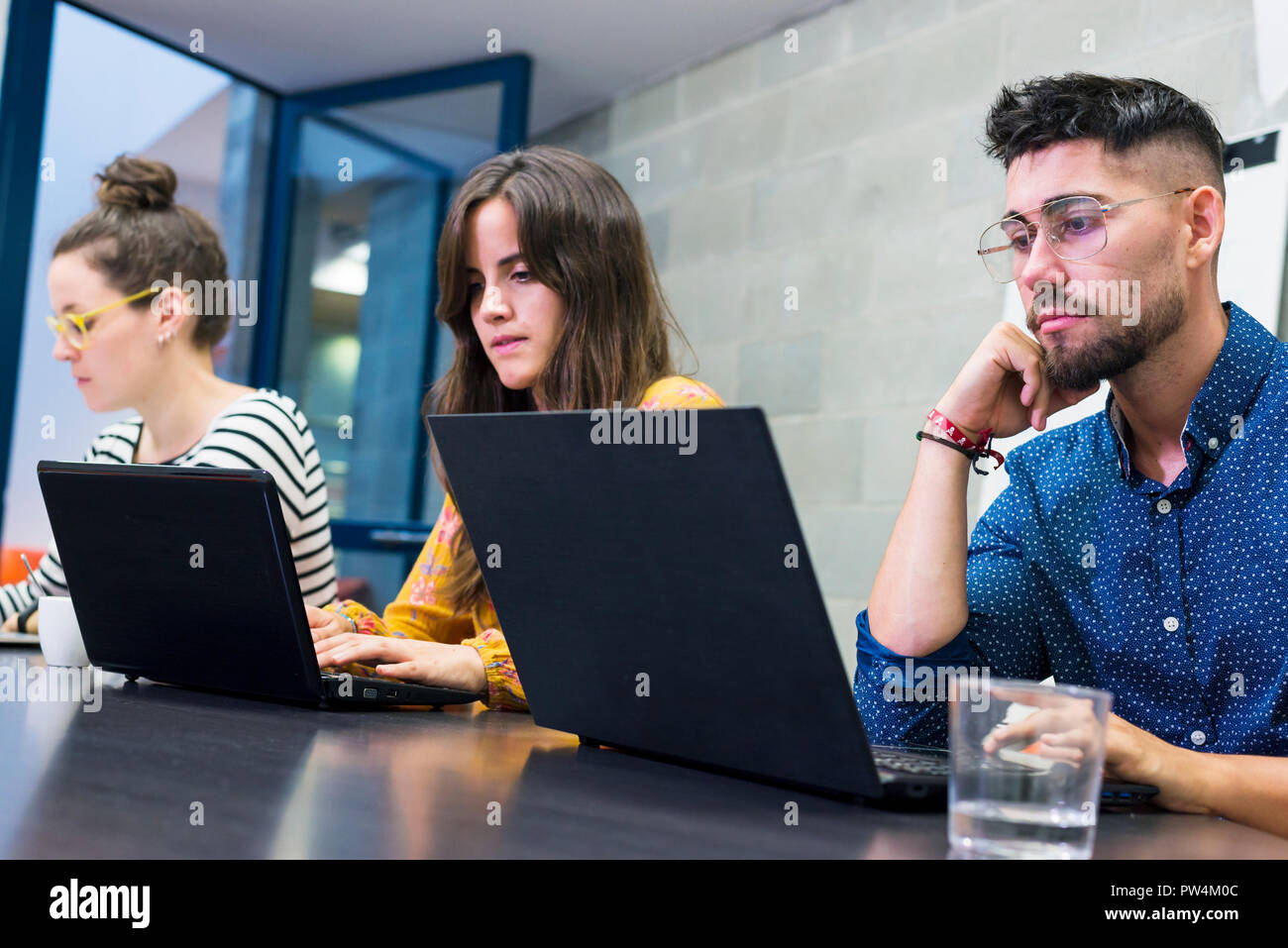 Group people laptop front view hi-res stock photography and images - Alamy