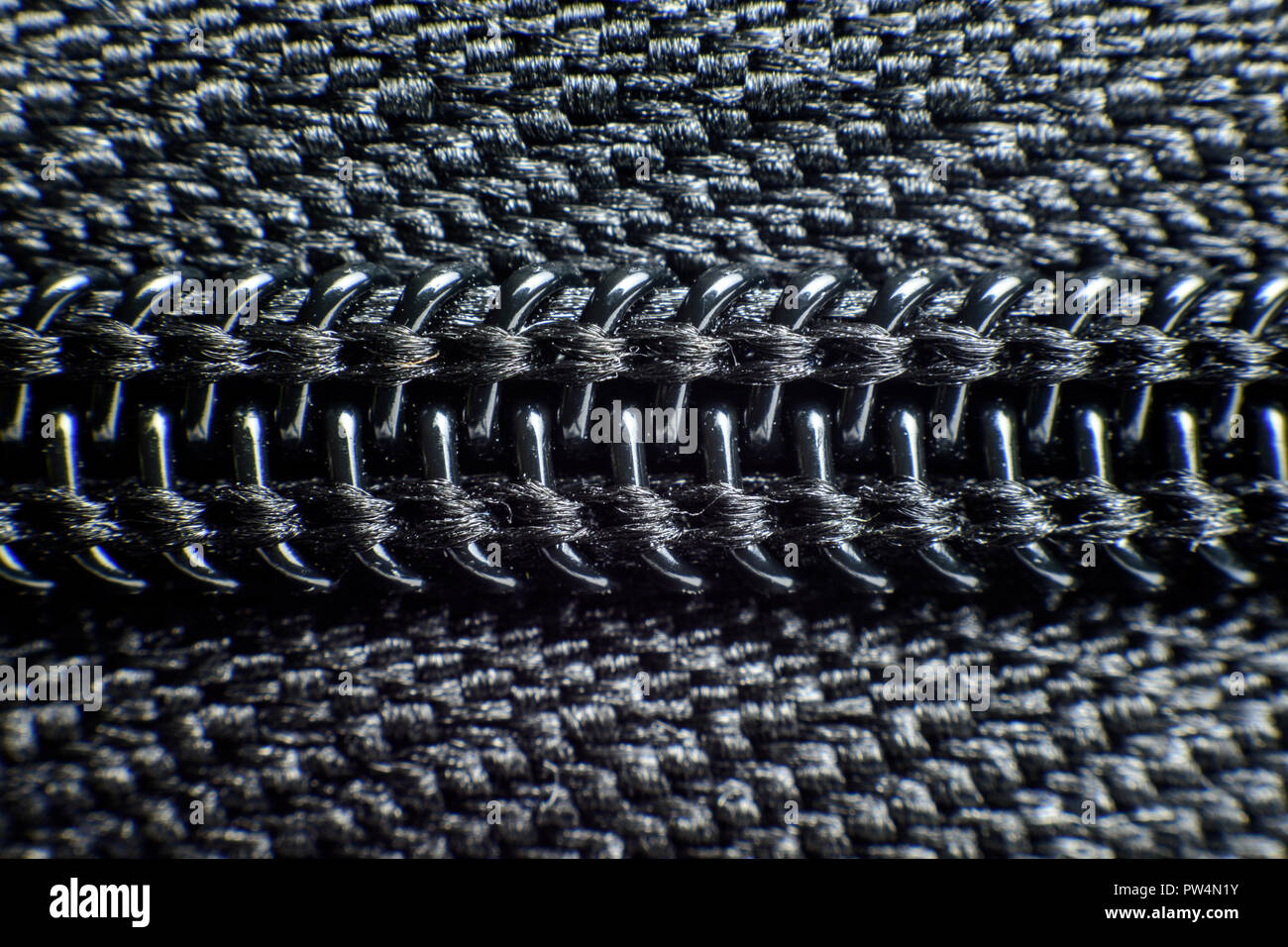 Close-up of black plastic zipper Stock Photo - Alamy