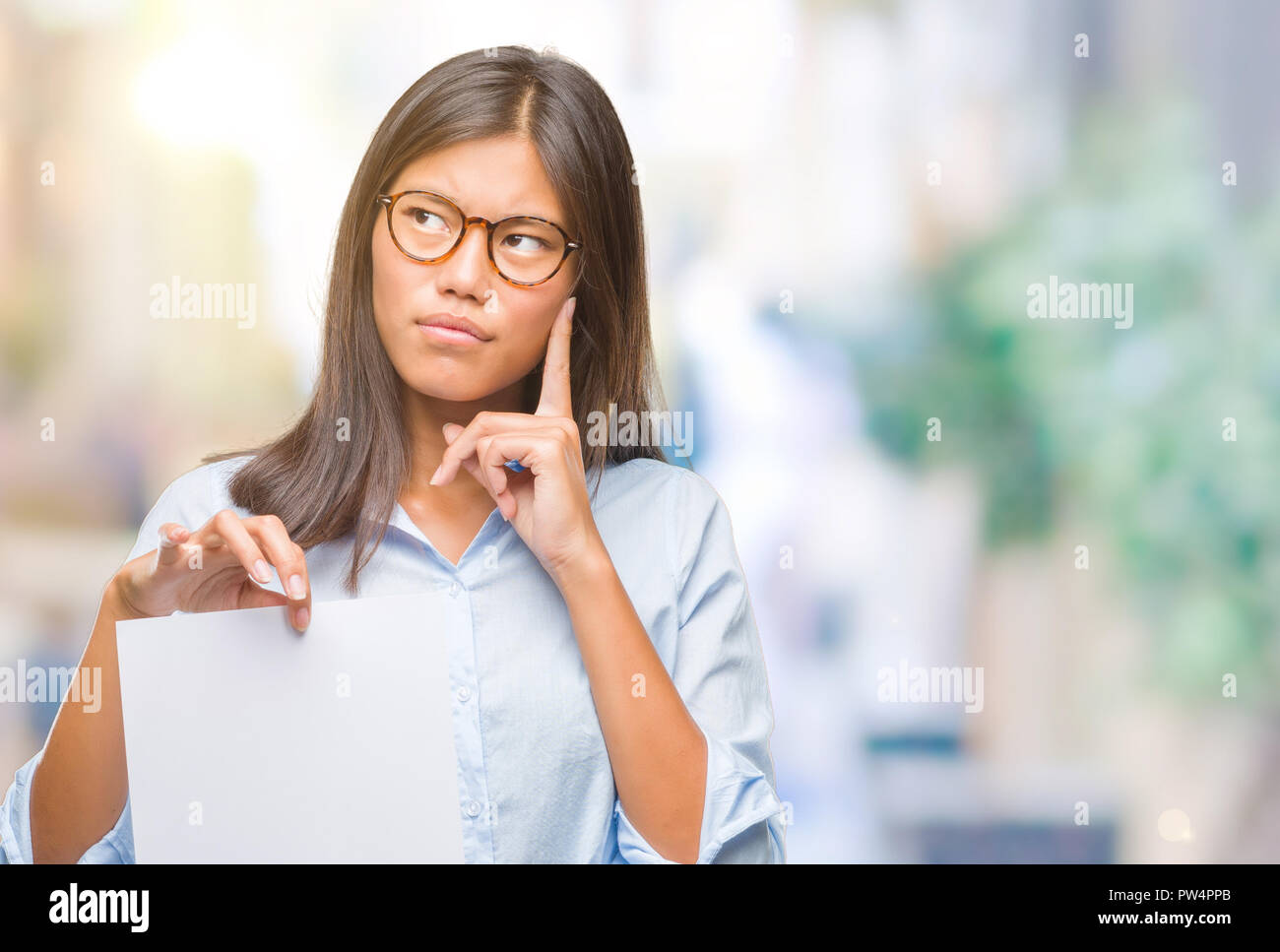 Woman sign contract thinking hi-res stock photography and images - Alamy
