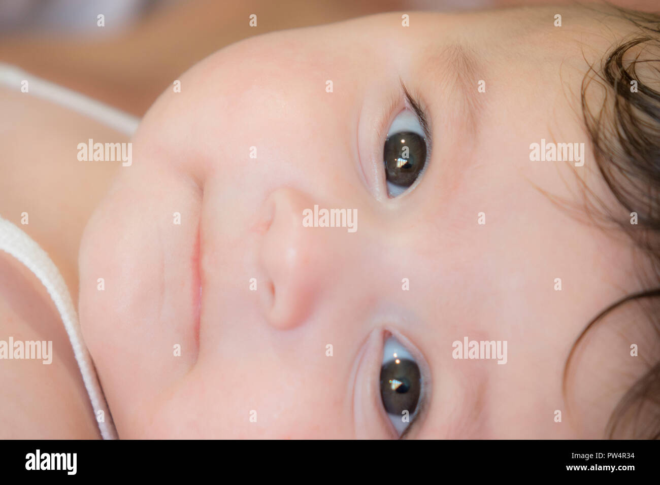 baby infant close-up portrait. looking at camera Stock Photo - Alamy