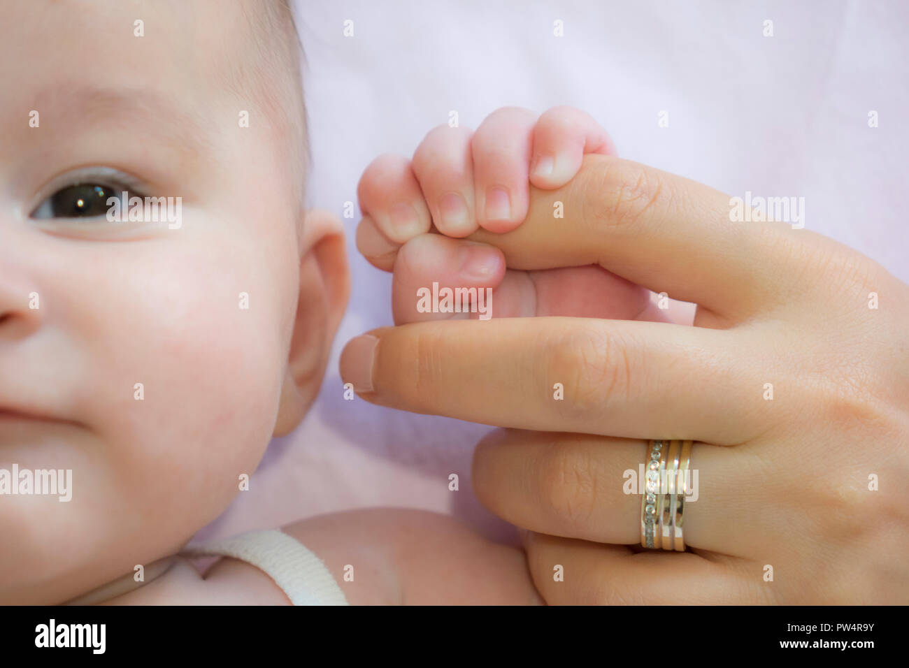 Soft focus of baby hands and mom, New family and baby protection ...