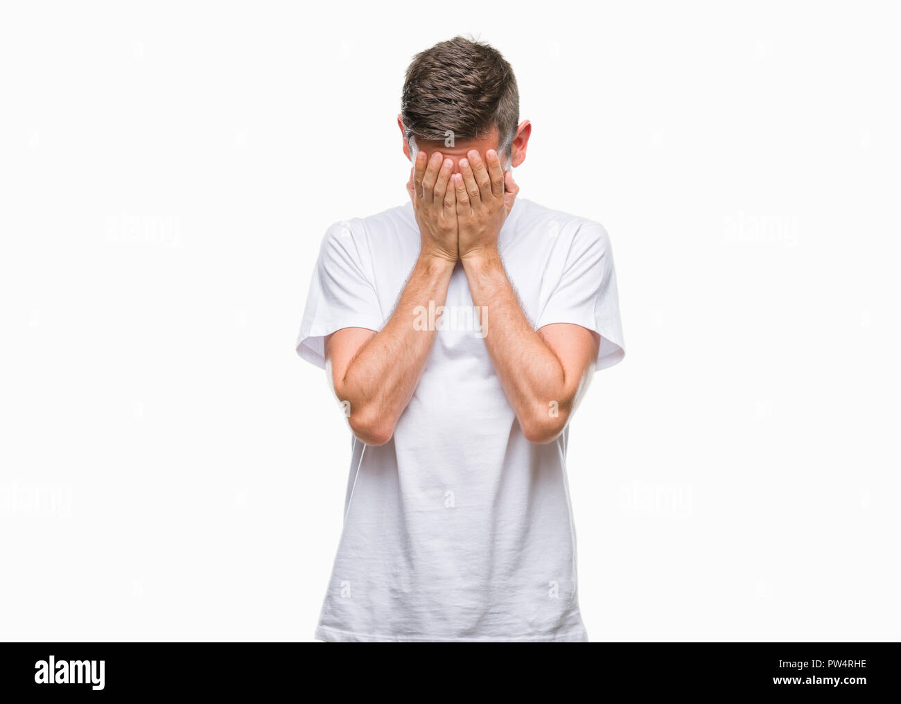 Young handsome man over isolated background with sad expression ...