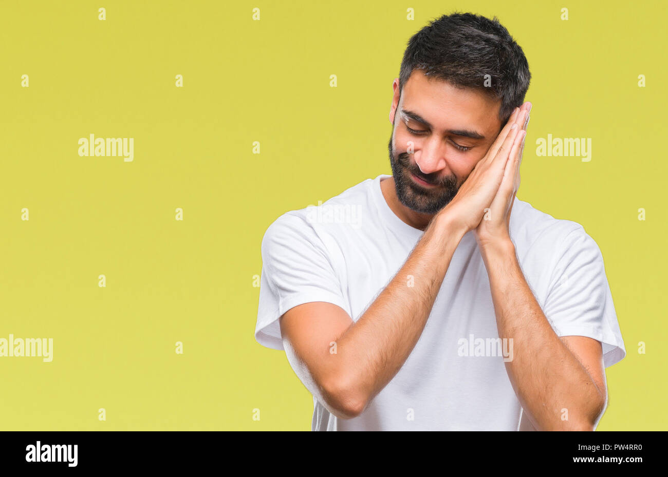 Adult hispanic man over isolated background sleeping tired dreaming and ...