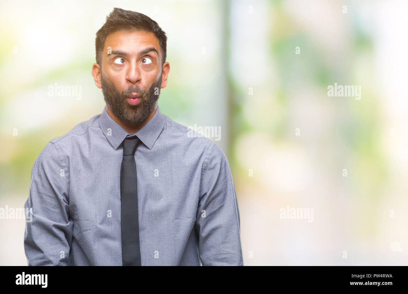 Adult hispanic business man over isolated background making fish face ...