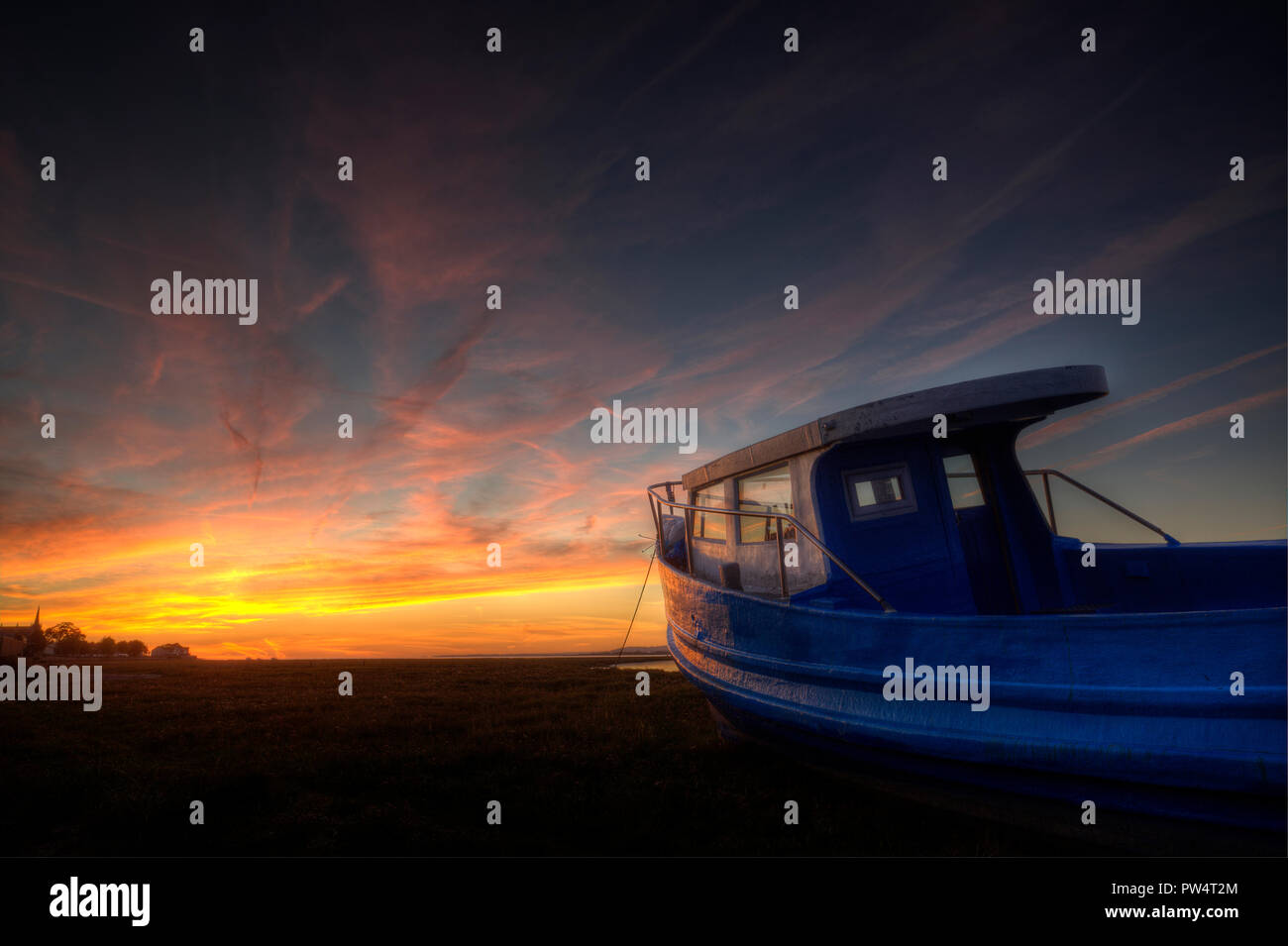 Blue fishing boat Stock Photo - Alamy