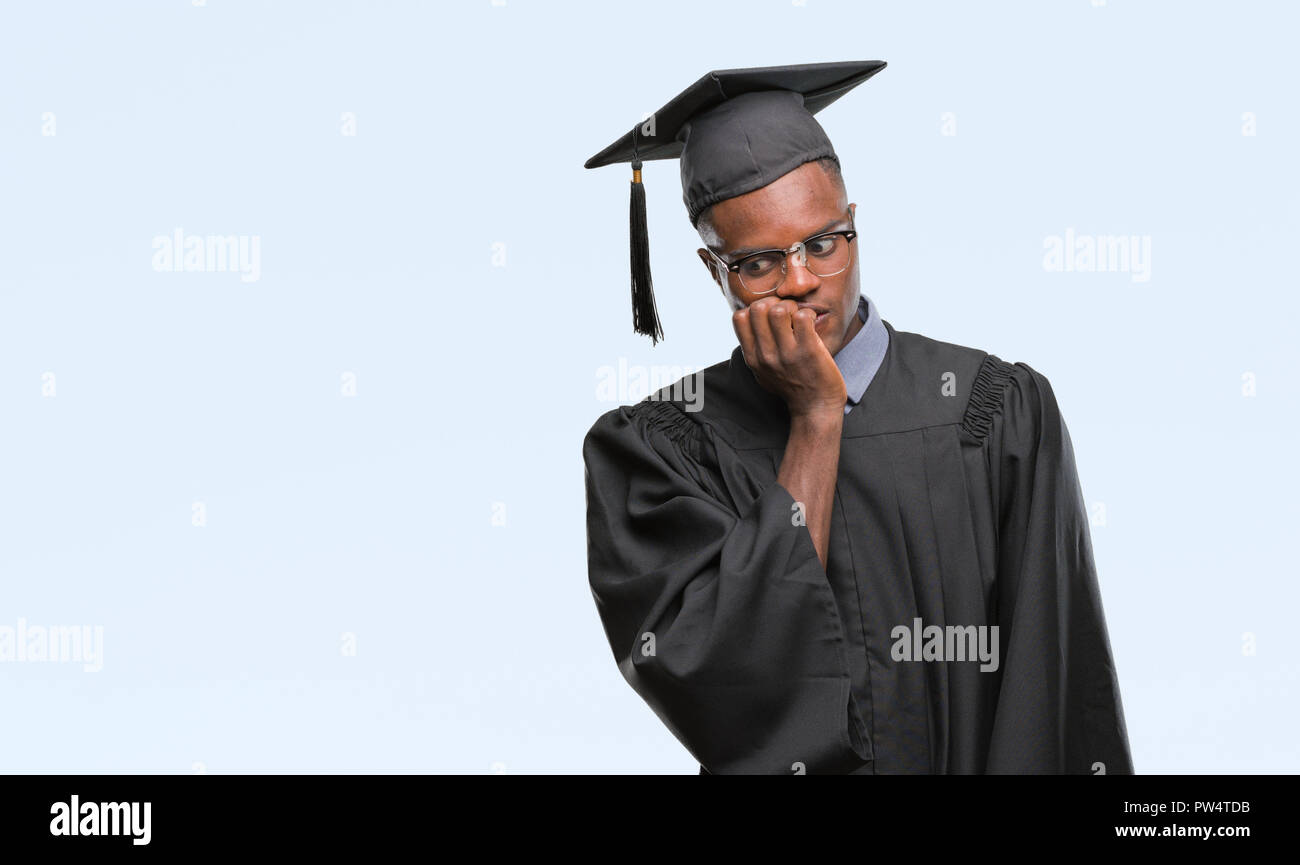 Young graduated african american man over isolated background looking ...
