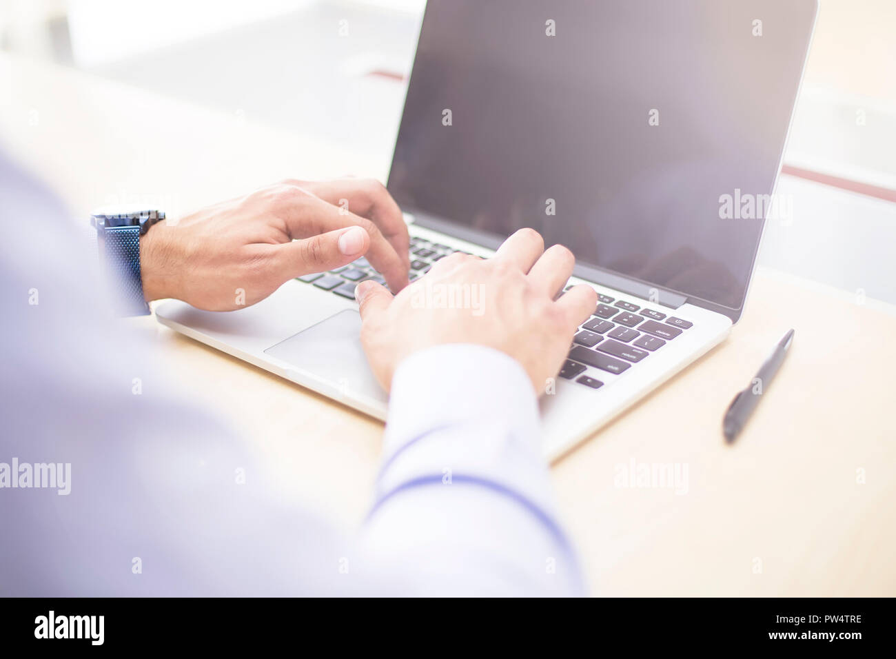 Mans hands using laptop phone hi-res stock photography and images - Alamy