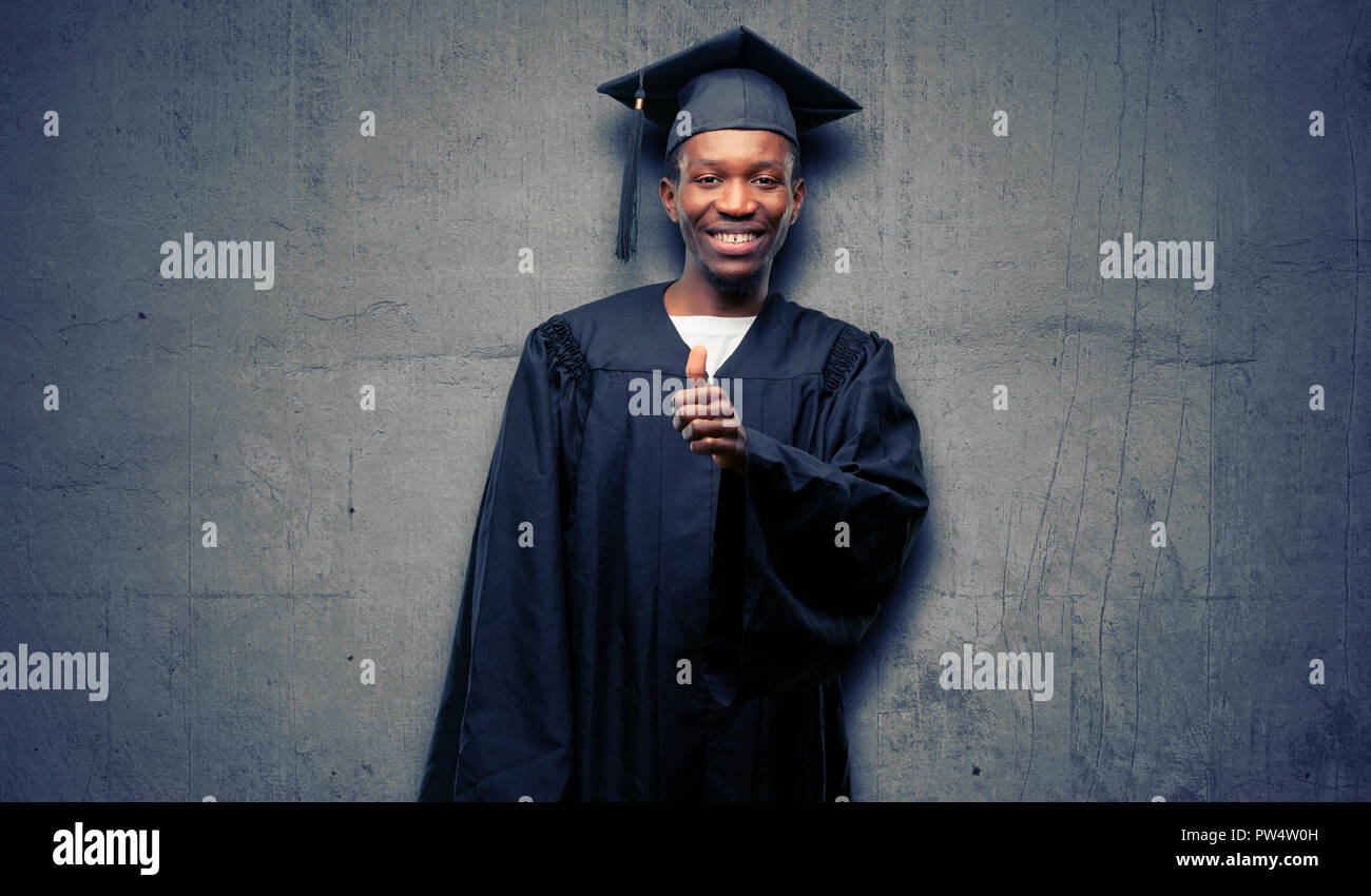 Young african graduate student black man smiling broadly showing thumbs ...