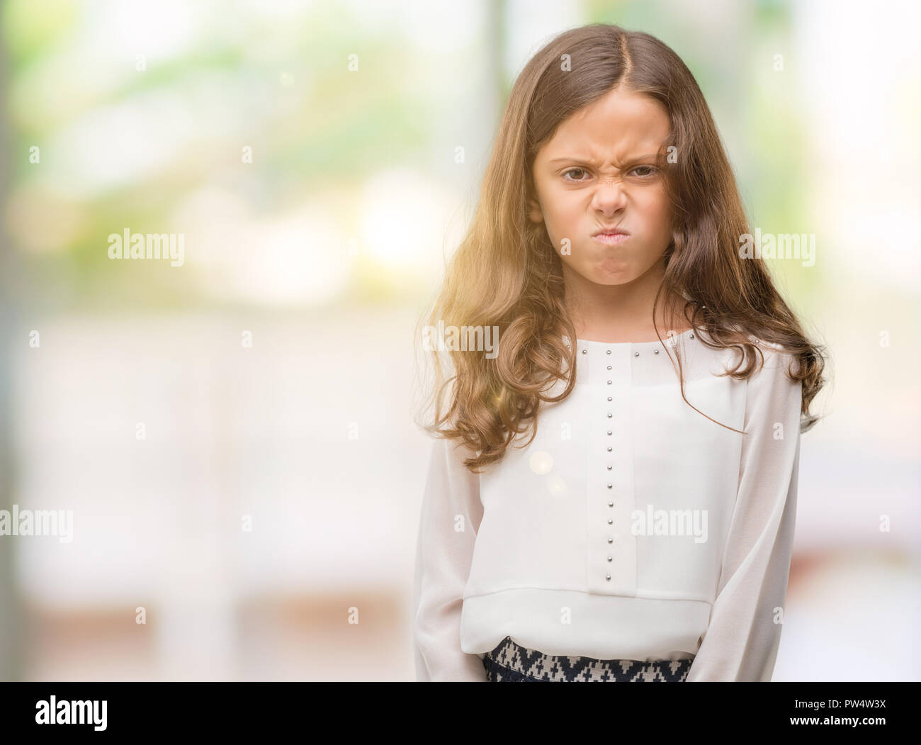 Brunette hispanic girl skeptic and nervous, frowning upset because of ...