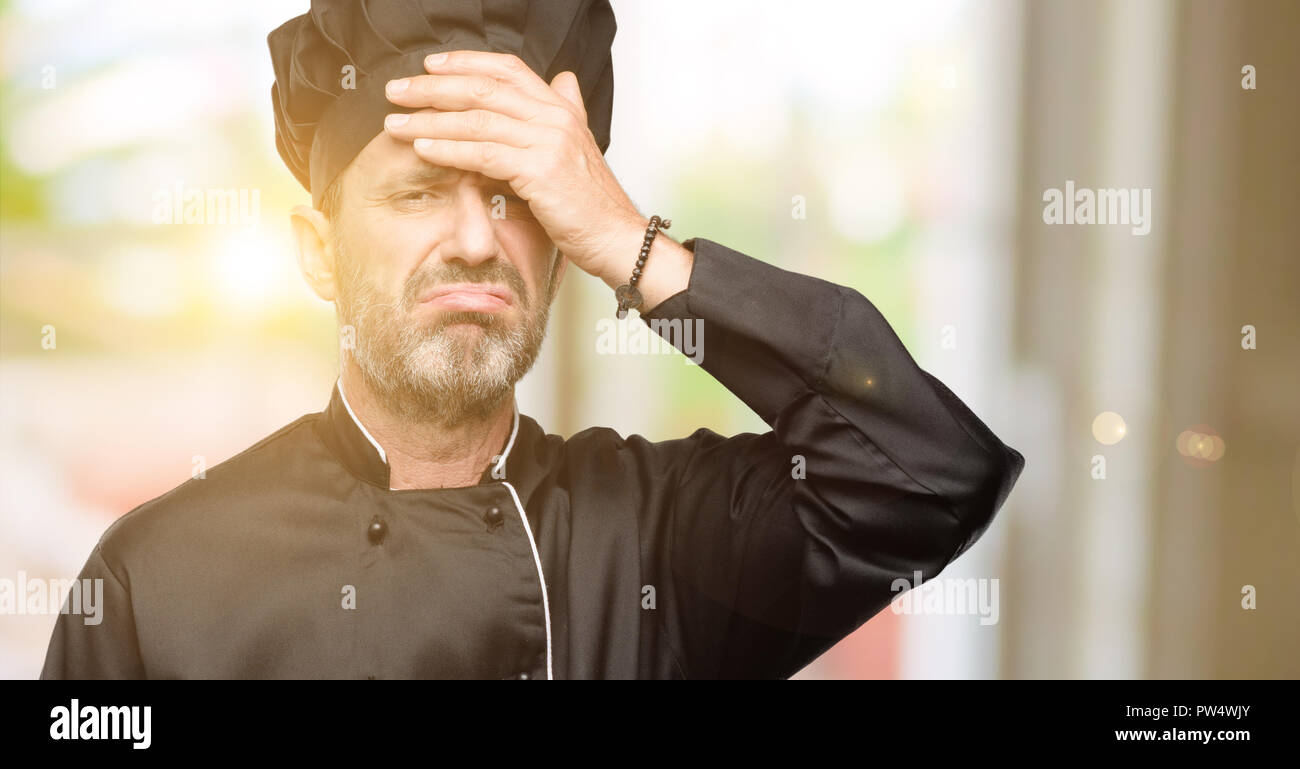 Senior cook man, wearing chef hat terrified and nervous expressing ...