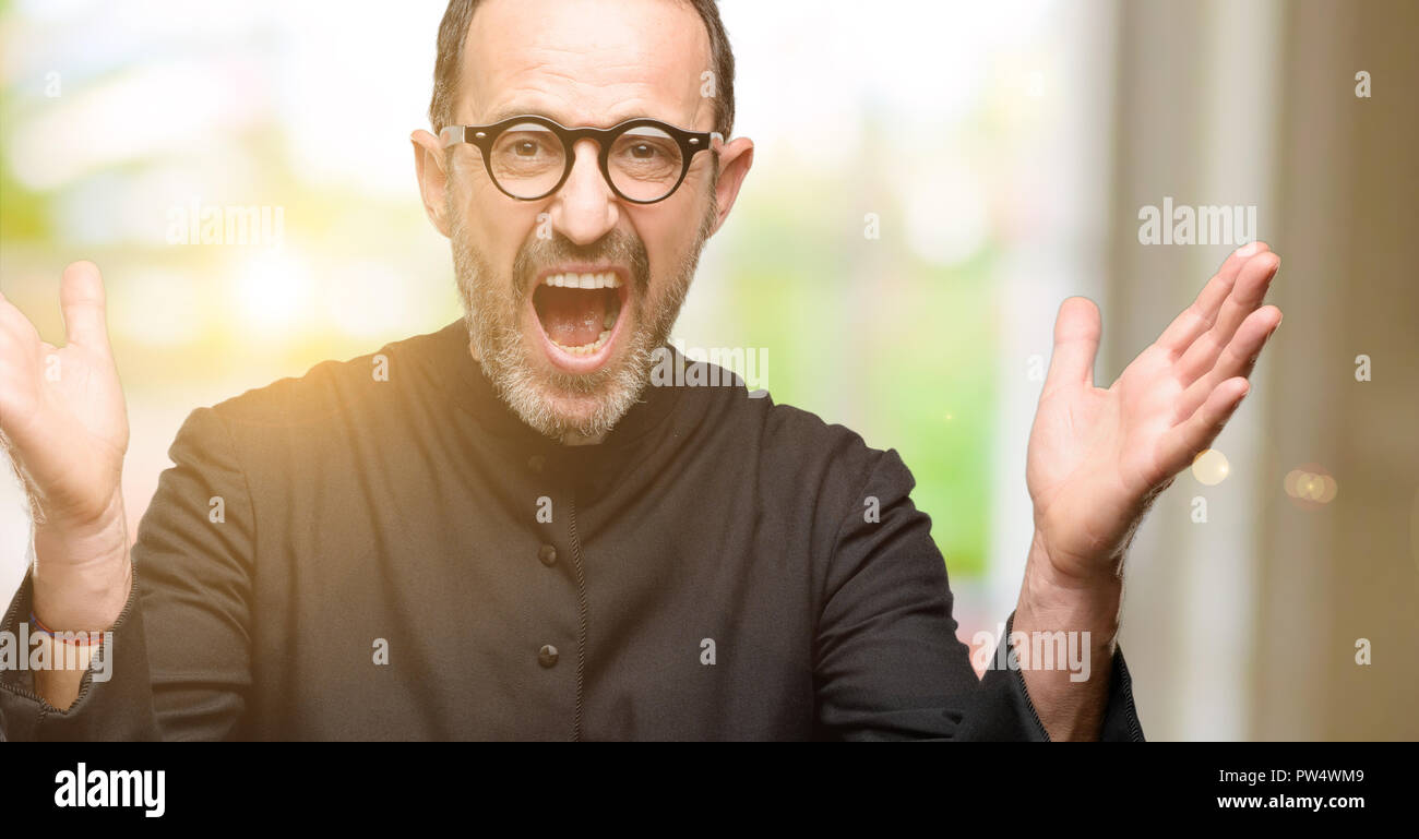 Priest religion man happy and surprised cheering expressing wow gesture ...