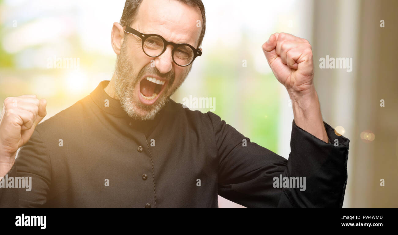 Priest religion man happy and excited celebrating victory expressing ...