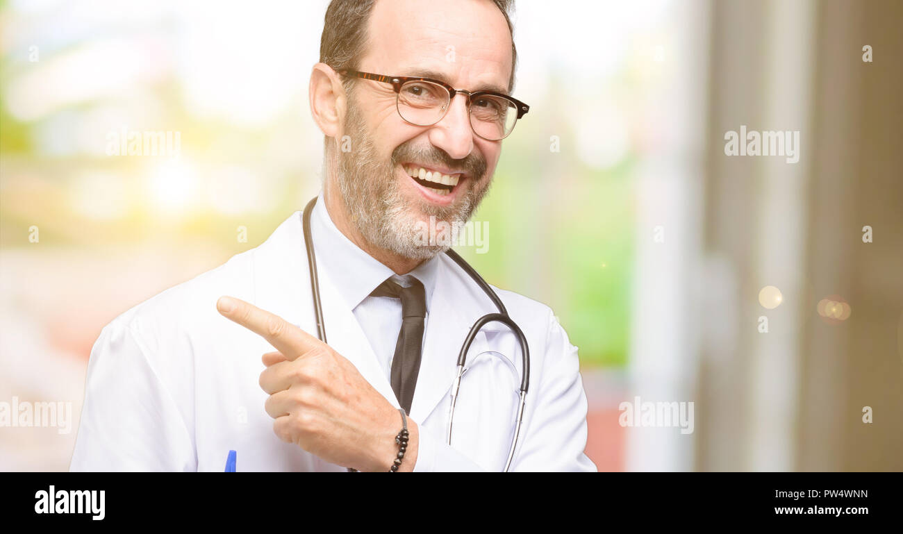 Man doctor laughing pointing finger hi-res stock photography and images ...