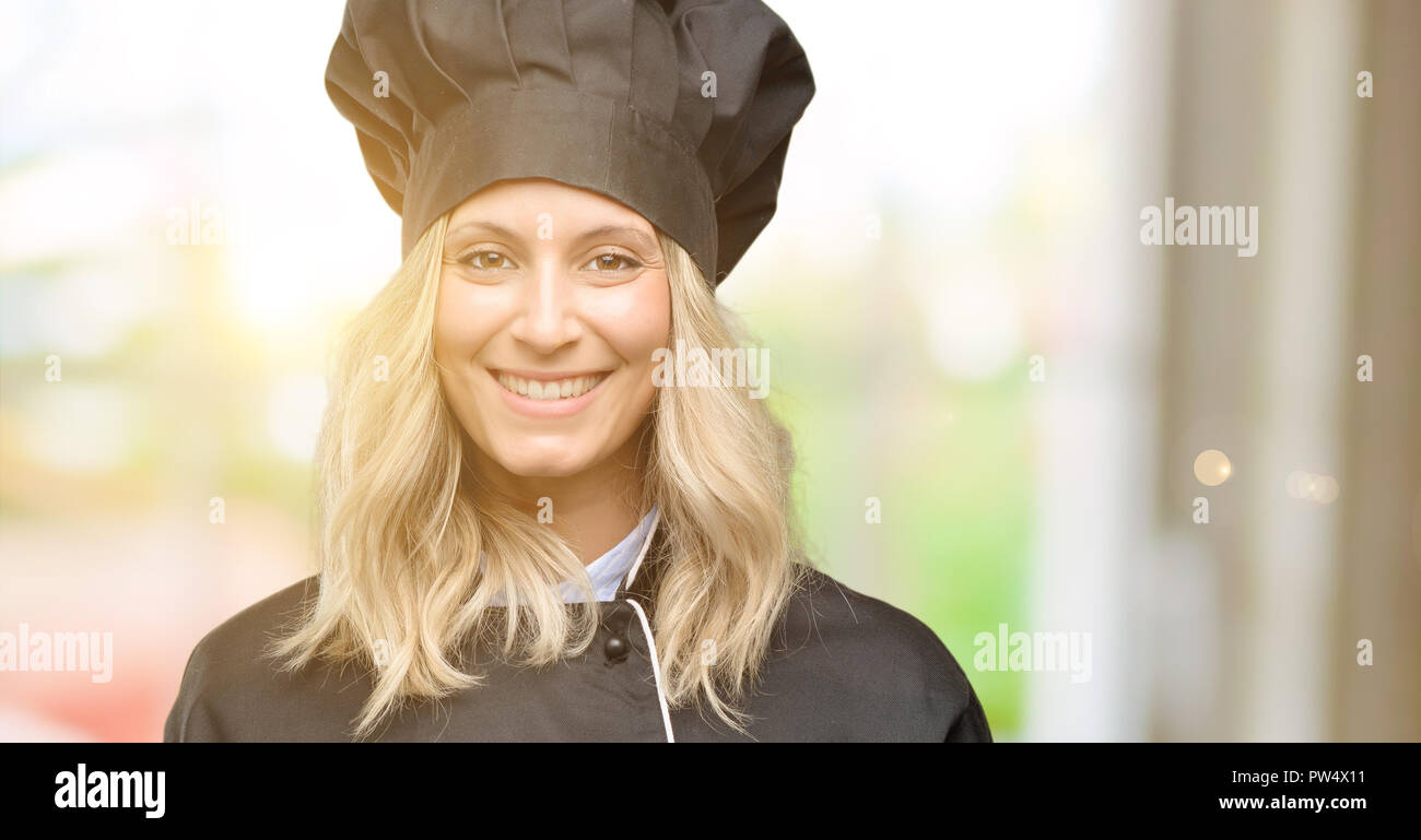 Beautiful cook woman chef holding blank advertising banner, good poster ...