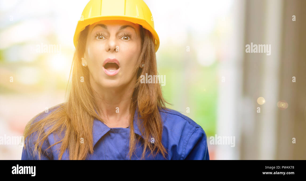 Engineer construction worker woman scared in shock, expressing panic ...