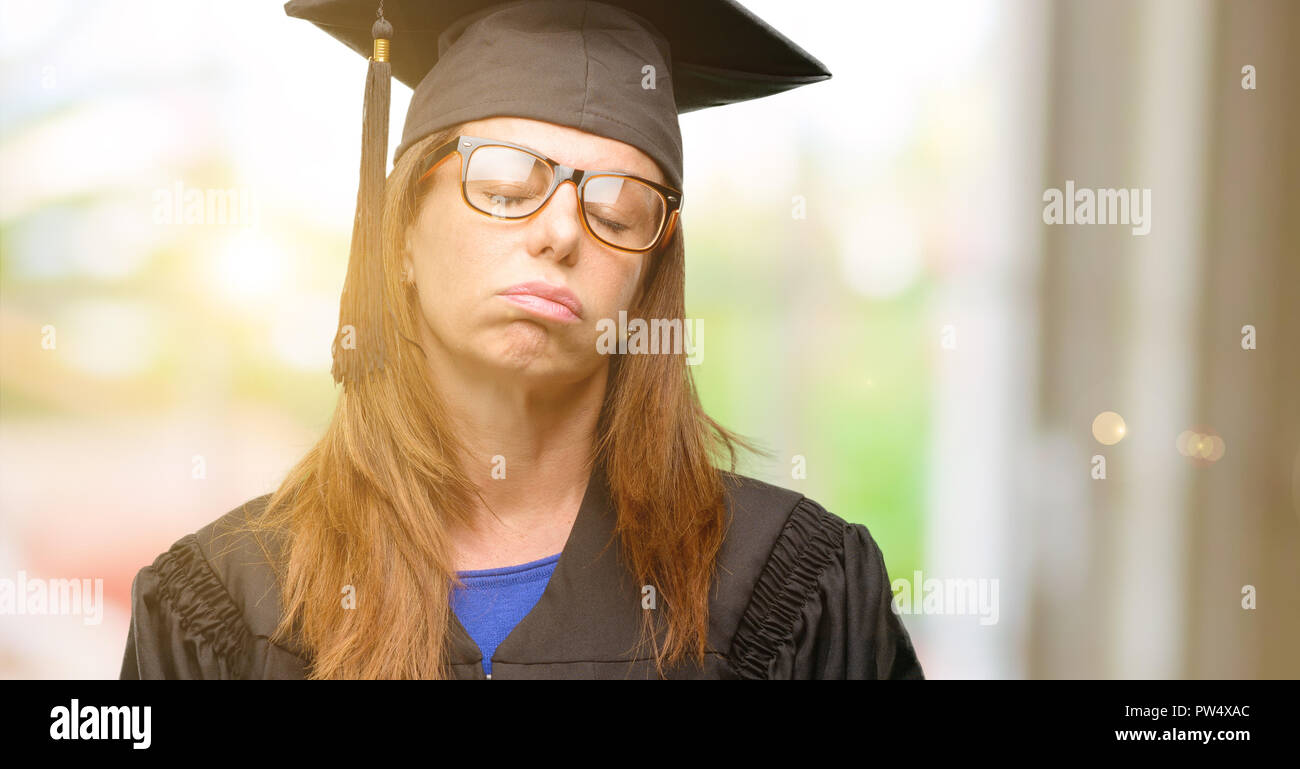 Senior graduate student woman with sleepy expression, being overworked ...