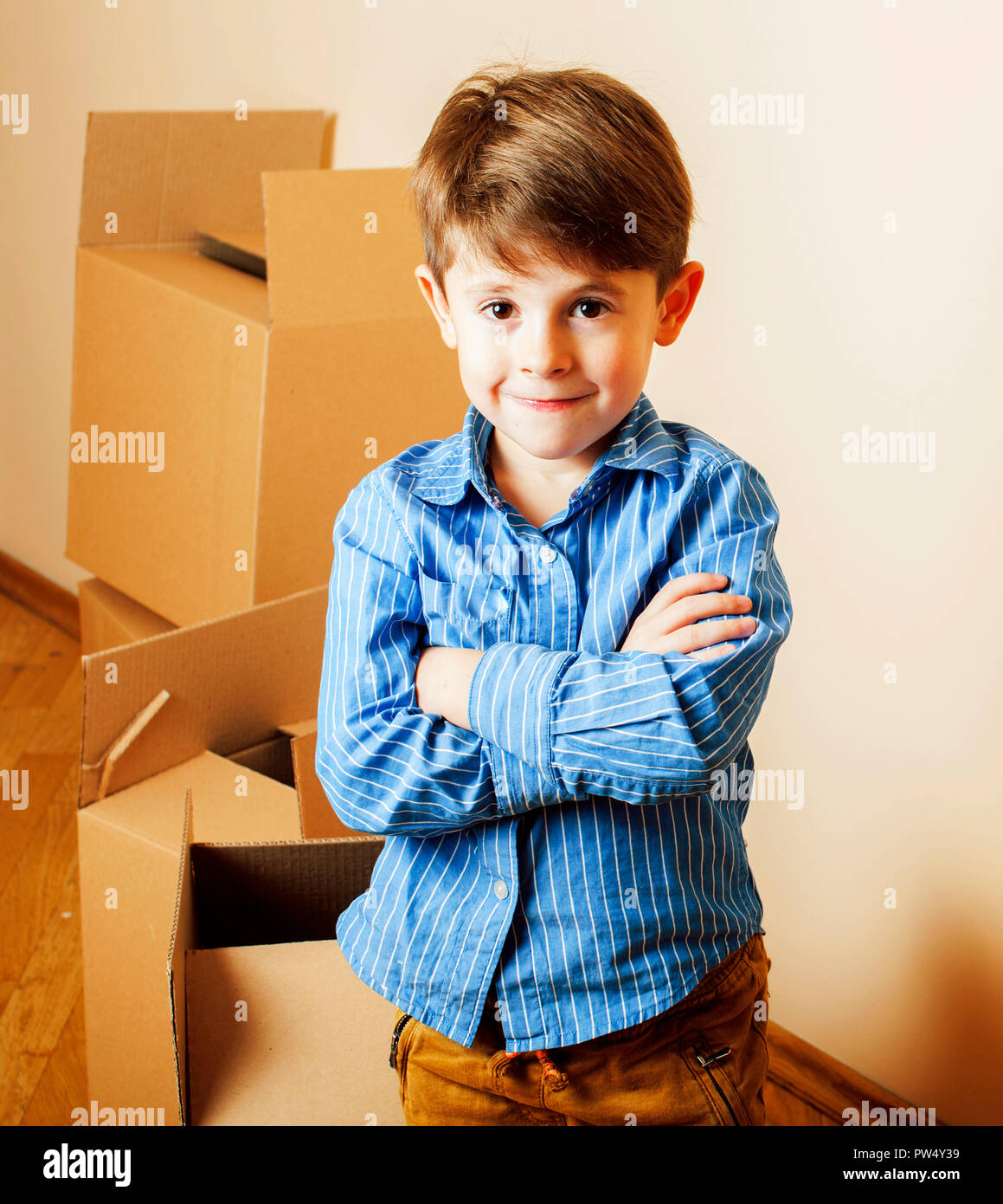 little cute boy in empty room, remove to new house. home alone Stock ...