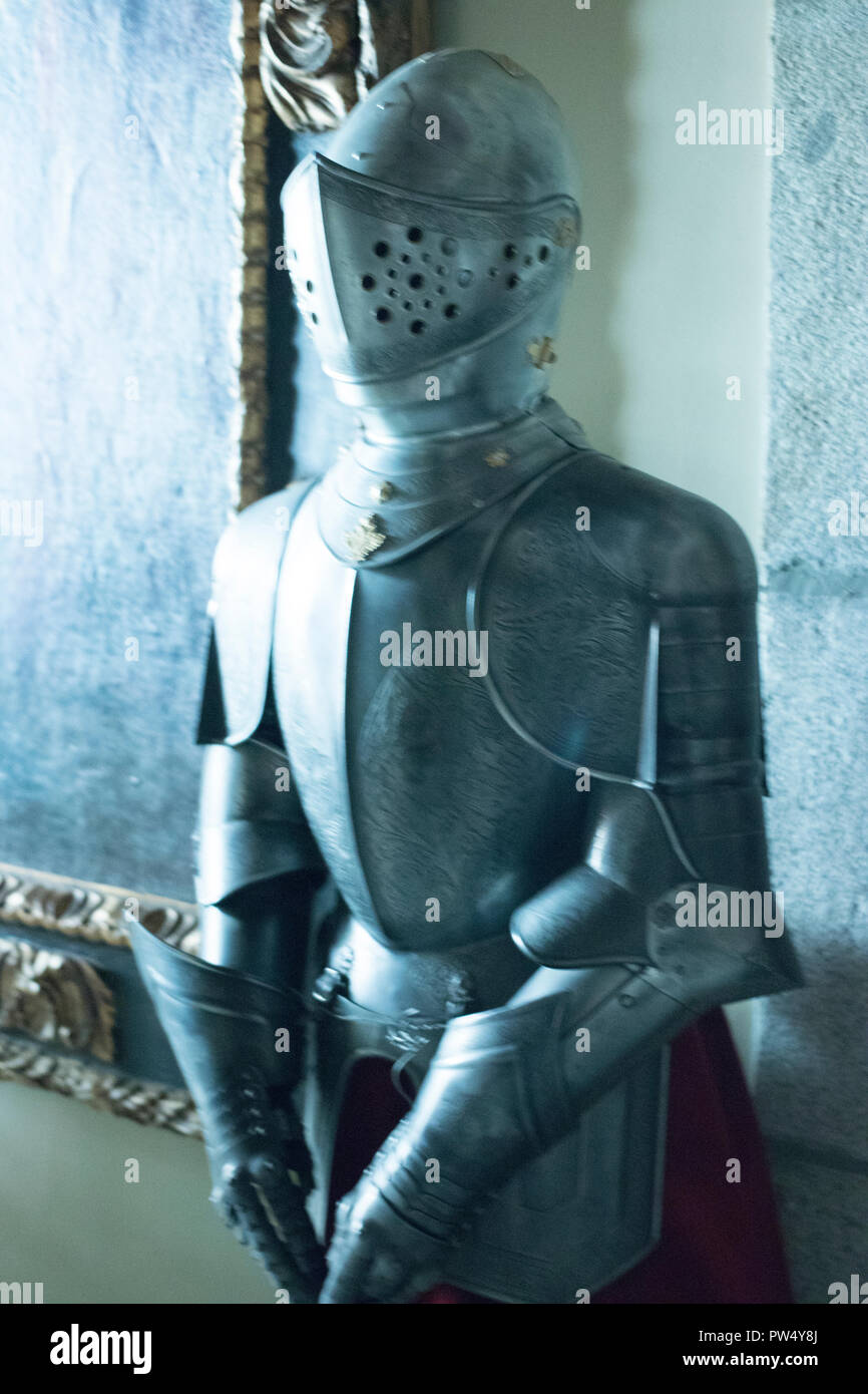 Medieval metal suit of armour and helmet worn by knight in middle ages ...
