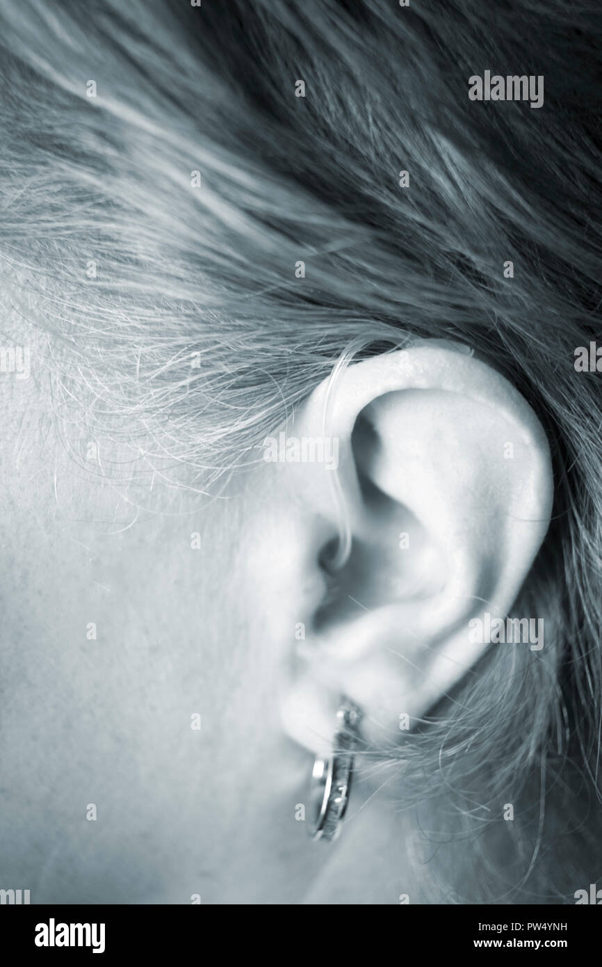 Deaf lady with modern technology digital hearing aid in her ear Stock ...