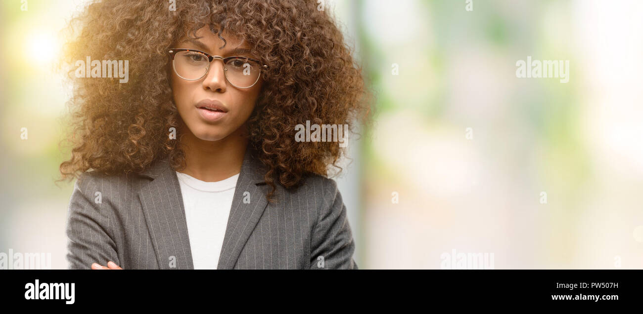 African american business woman wearing glasses skeptic and nervous ...