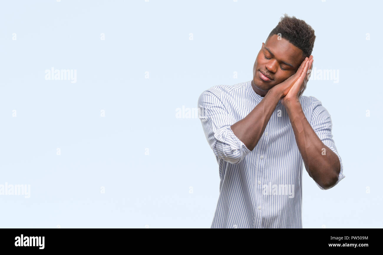 Young african american man over isolated background sleeping tired ...
