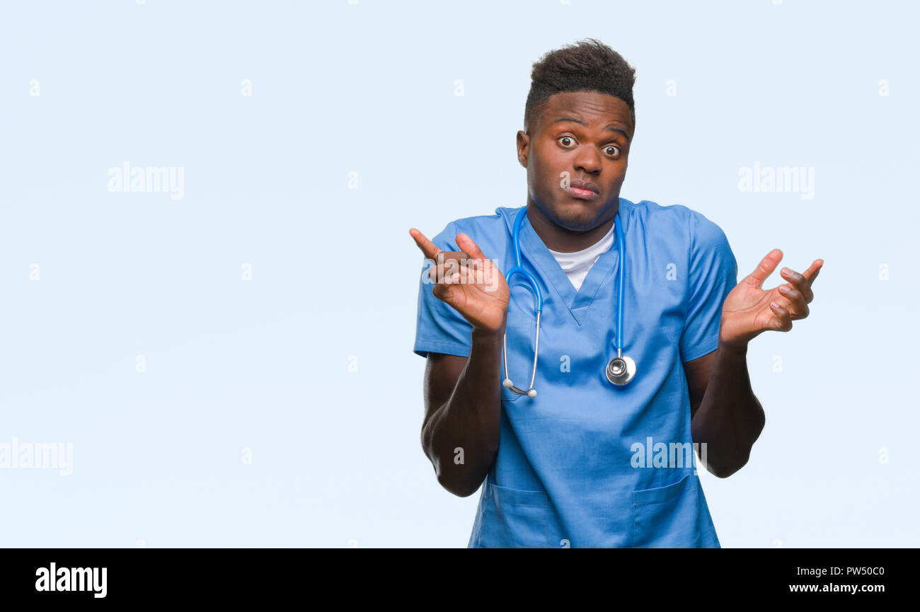 Young african american doctor man over isolated background wearing ...