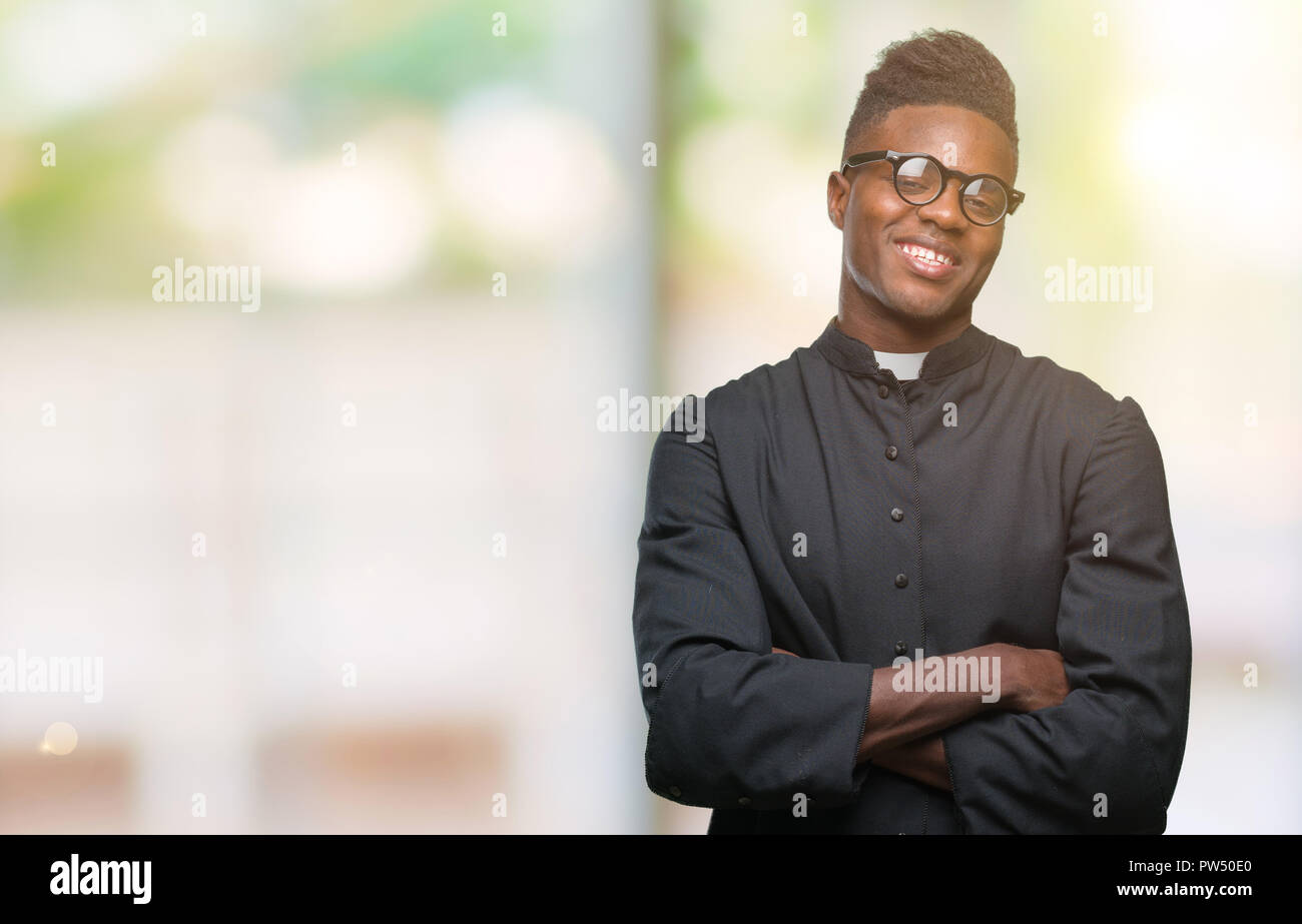 Young african american priest man over isolated background happy face ...