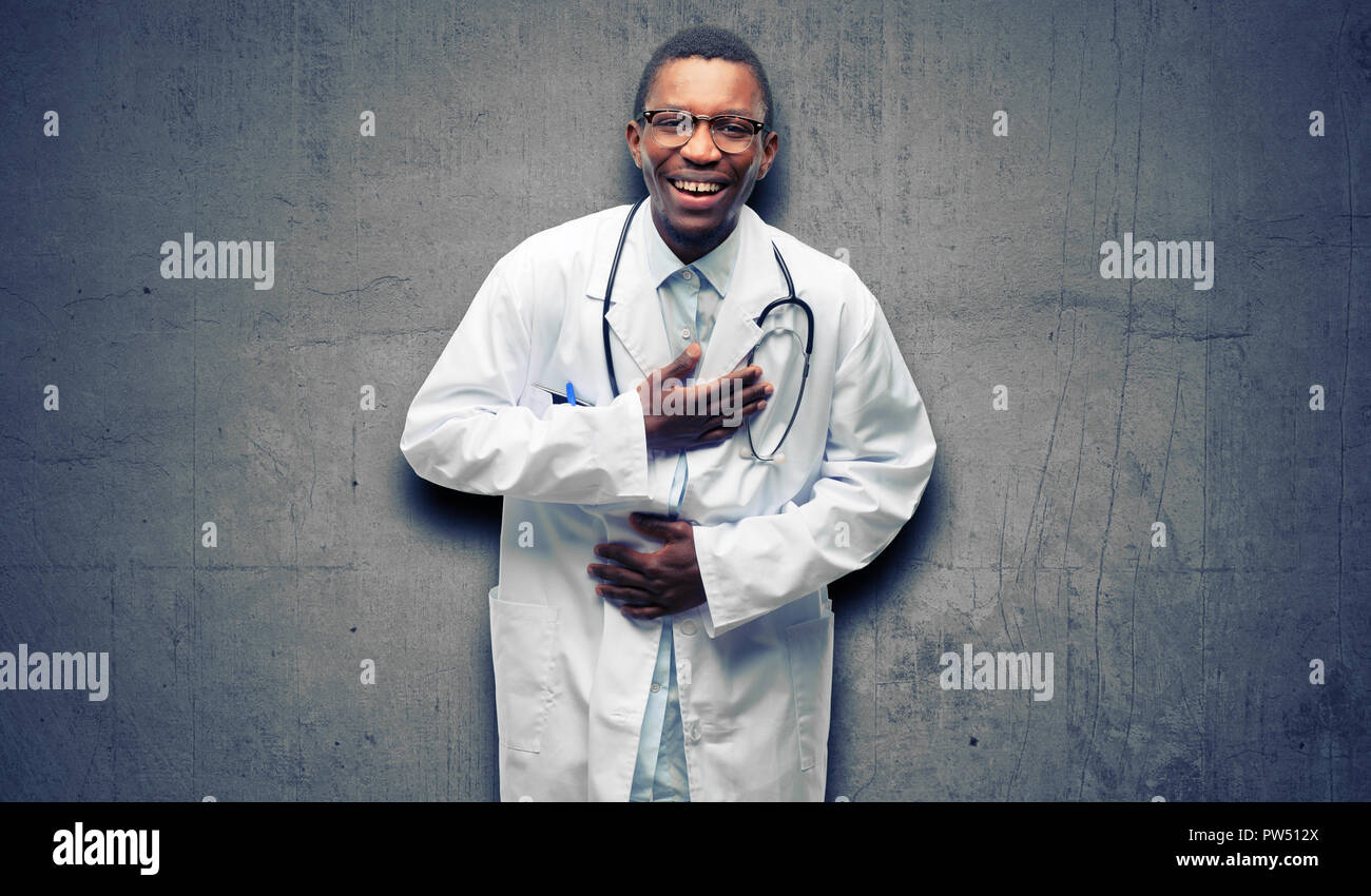 Young black doctor, medical professional confident and happy with a big ...