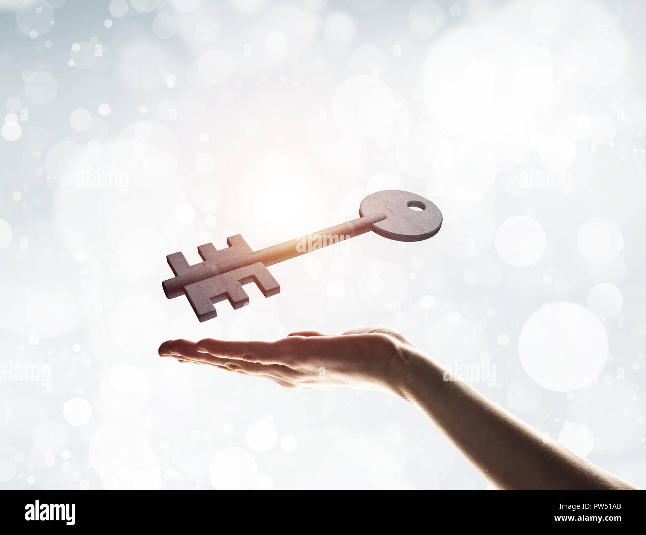 Key to new opportunities and success concept by symbol on hand Stock ...