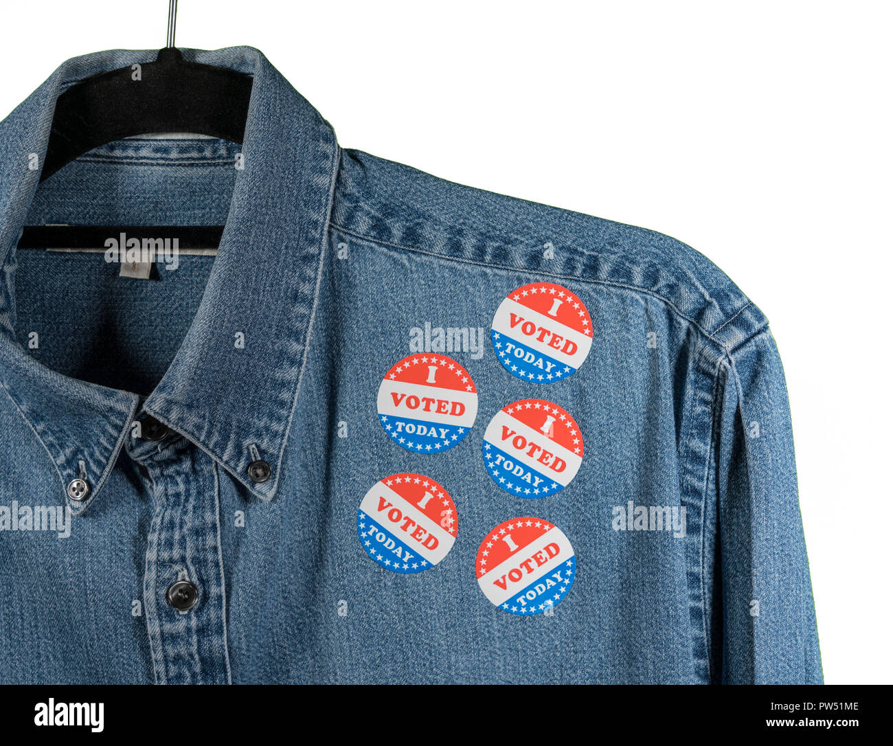 Blue denim working clothing with many Voted stickers on white ...