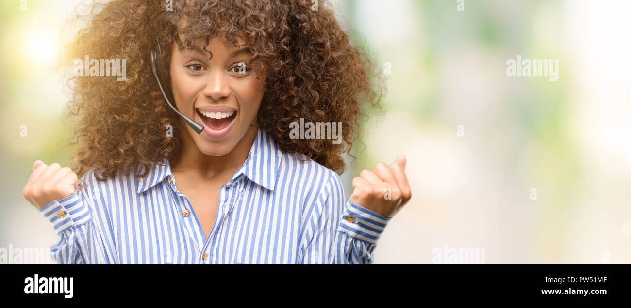 African american call center operator woman screaming proud and ...
