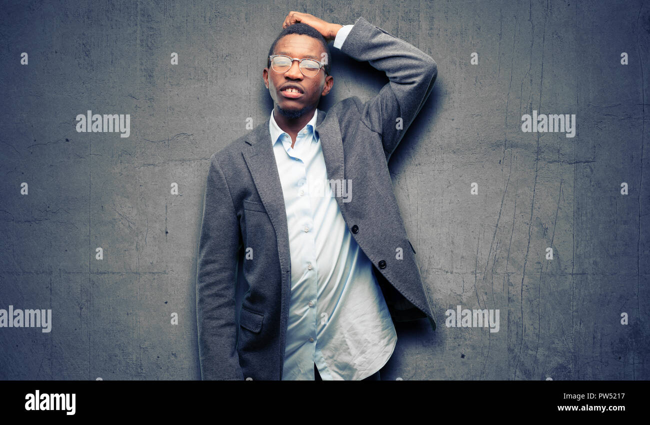 African black man wearing jacket doubt expression, confuse and wonder ...