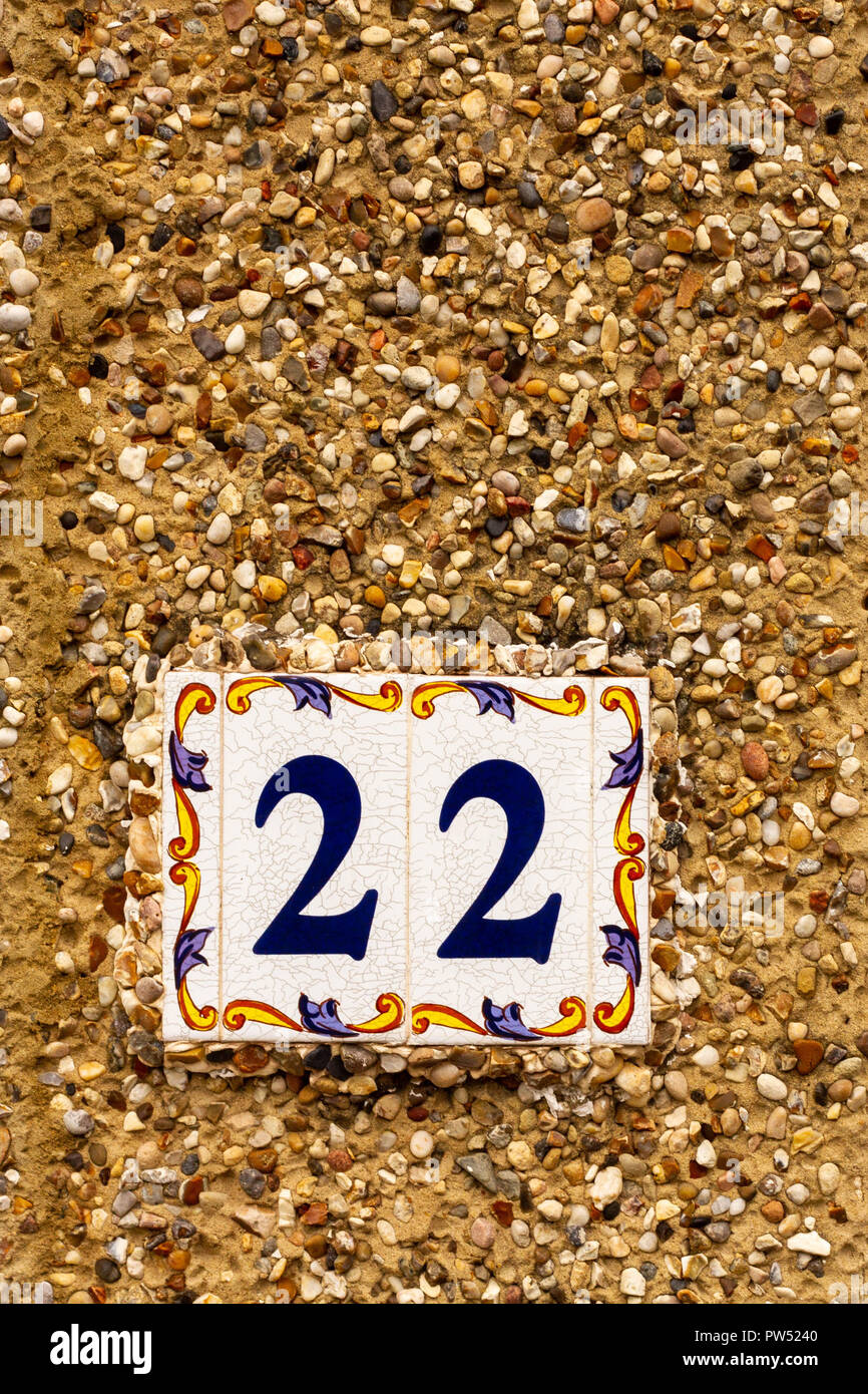 House number 22 with the twenty-two in blue on colourful tiles or ...